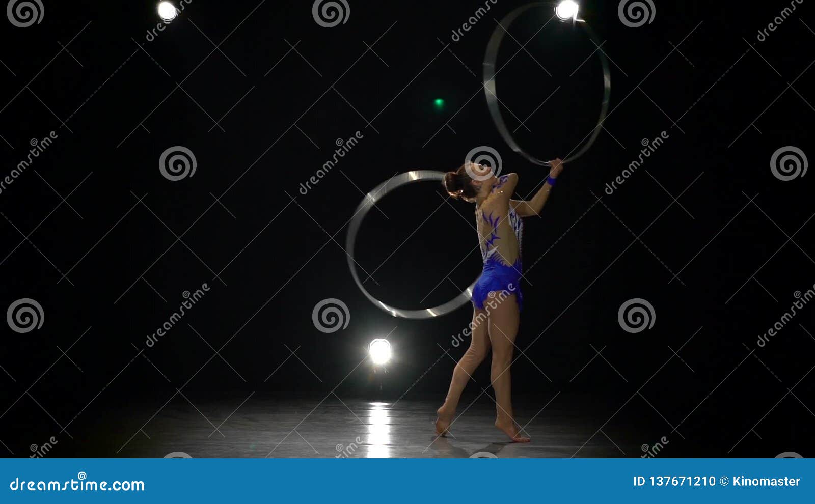 Acrobat with Hoops in His Hands Performs Various Tricks. Slow Motion ...