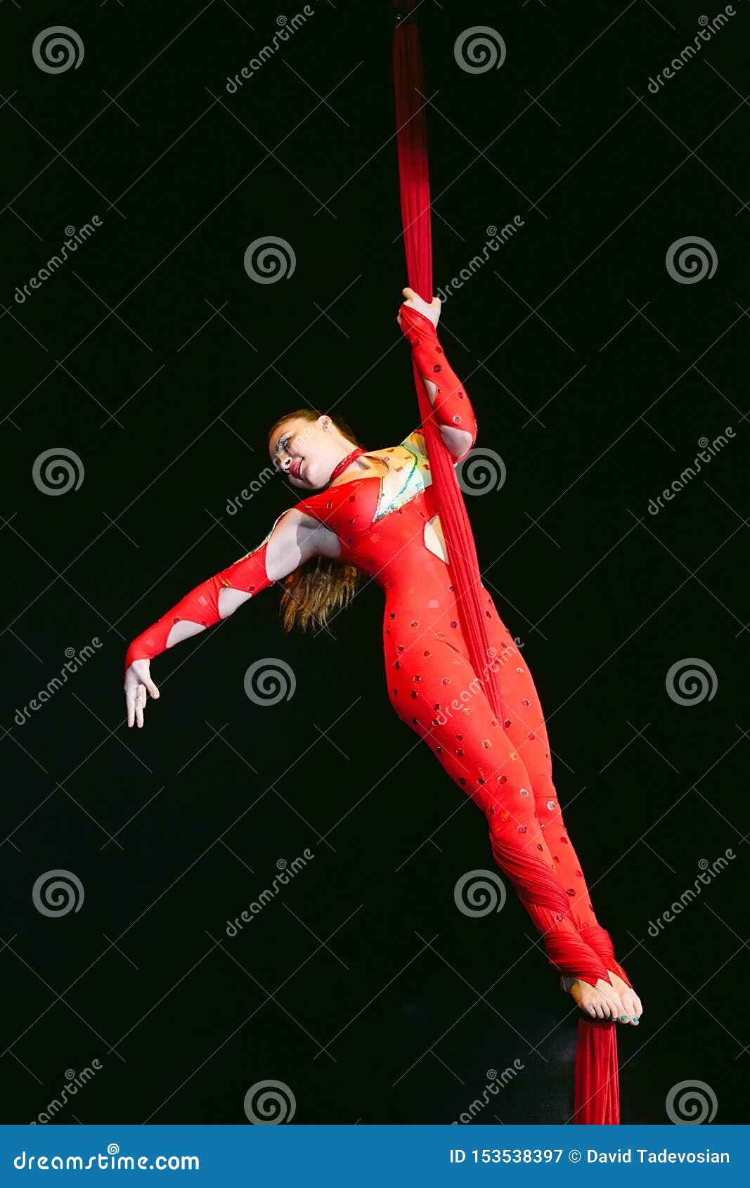Acrobat Performs a Difficult Trick in the Circus. Stock Image - Image ...