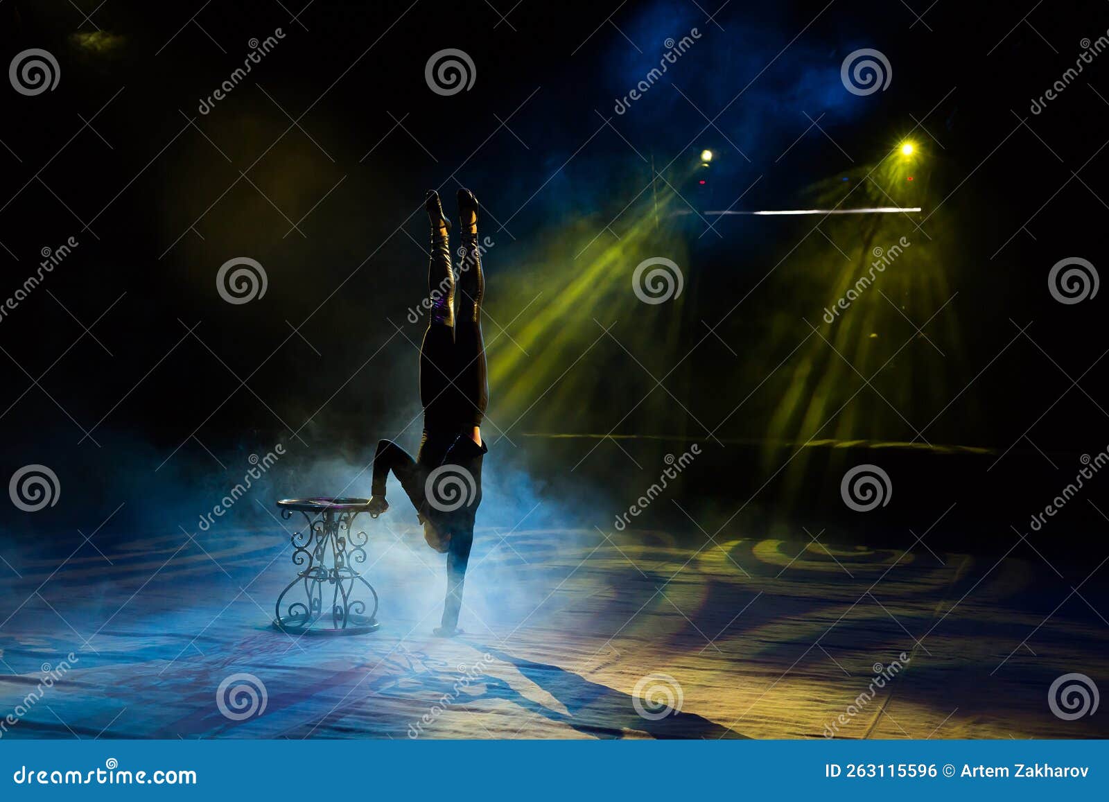 Acrobat Performs a Difficult Trick in the Circus. Editorial Photo ...