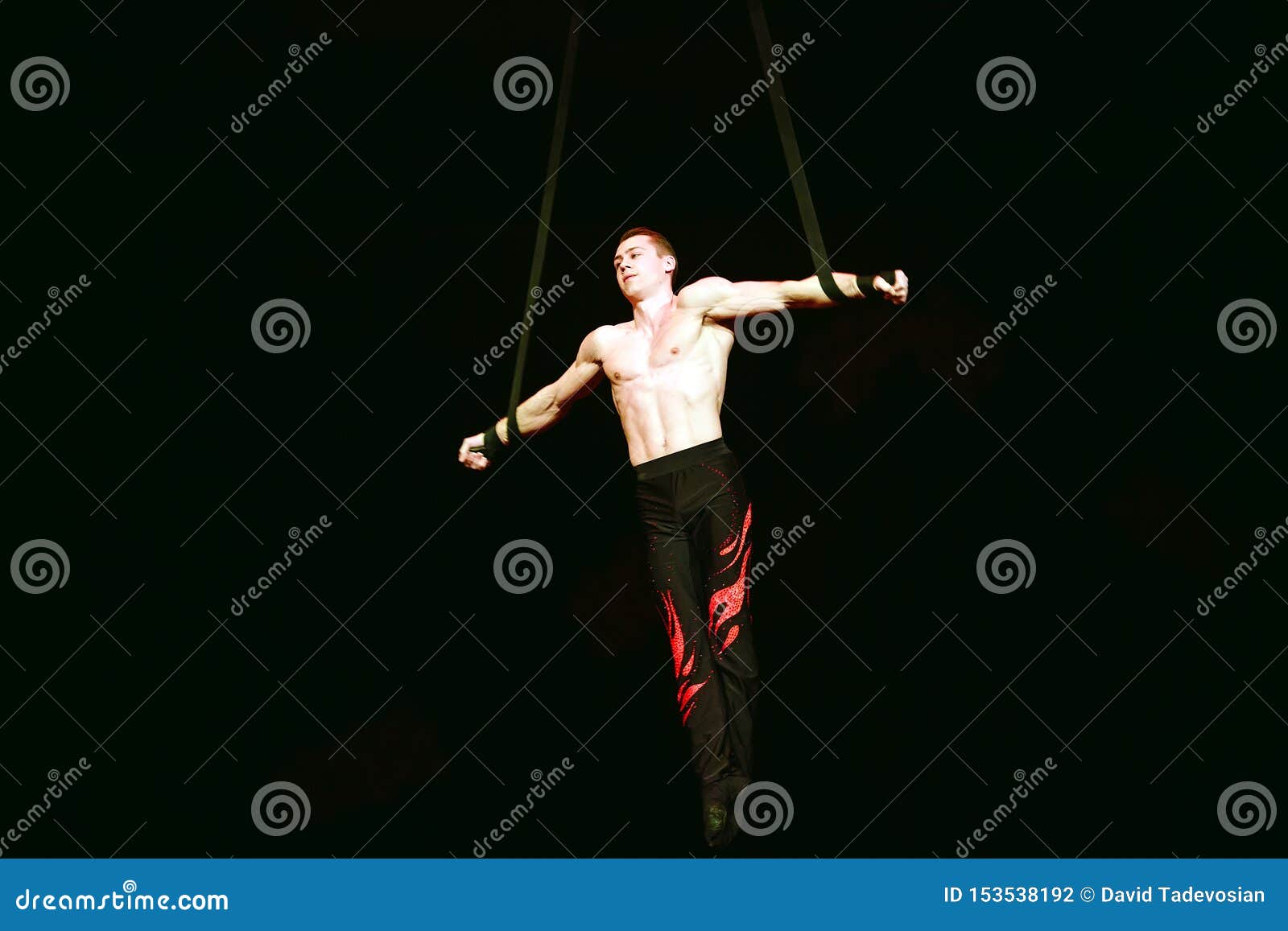 Acrobat Performs a Difficult Trick in the Circus. Editorial Photography ...