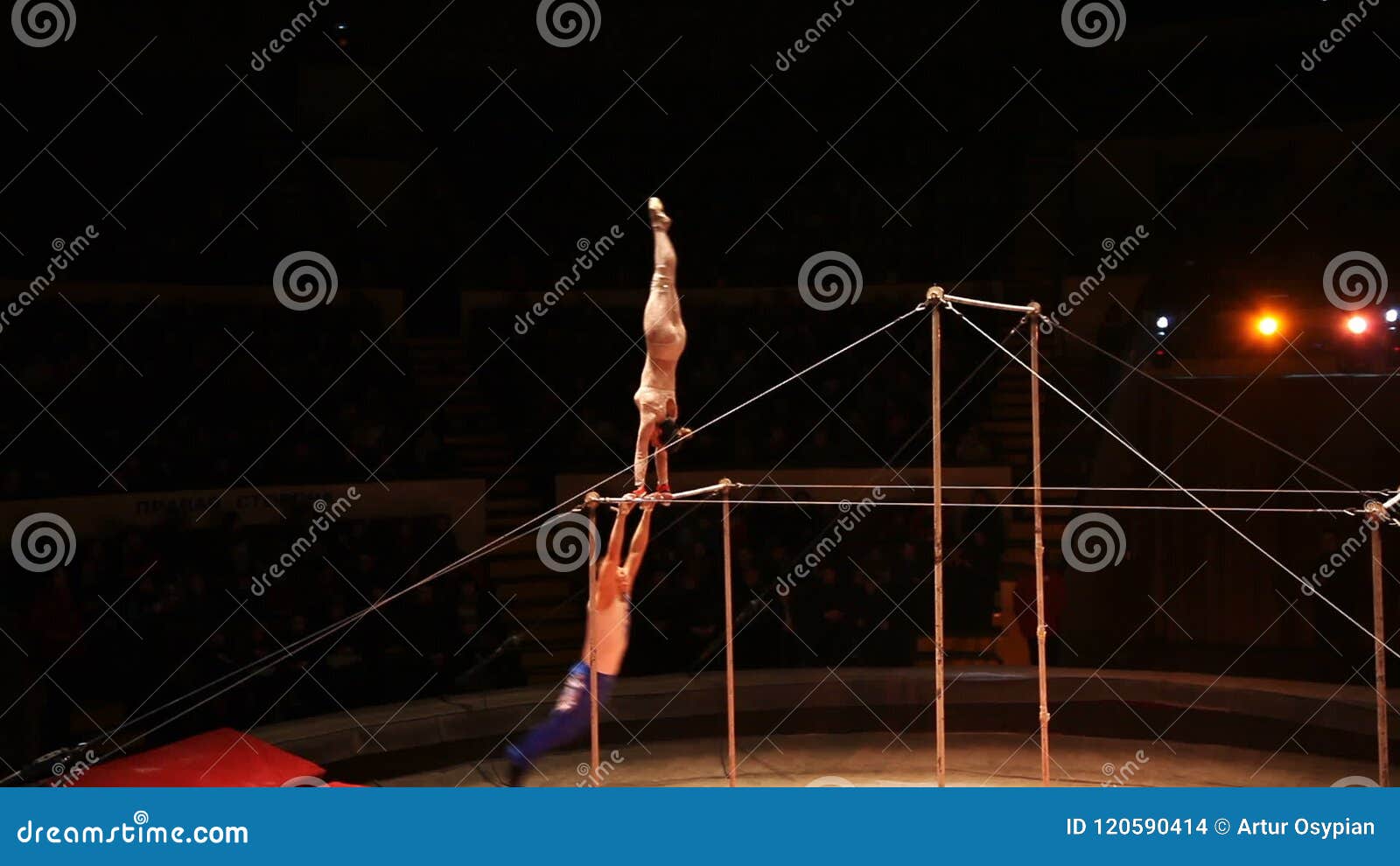 Acrobat Performs Exercises on the Bar in the Circus Arena Stock Footage ...