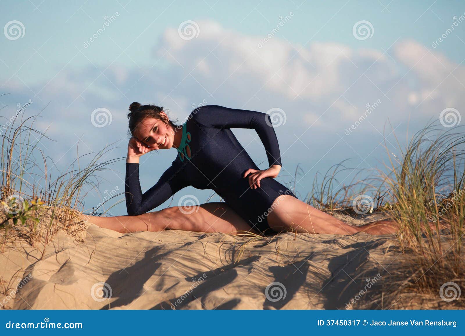 Acrobatic Gymnast is Doing the Split on the Beach Stock Image - Image ...
