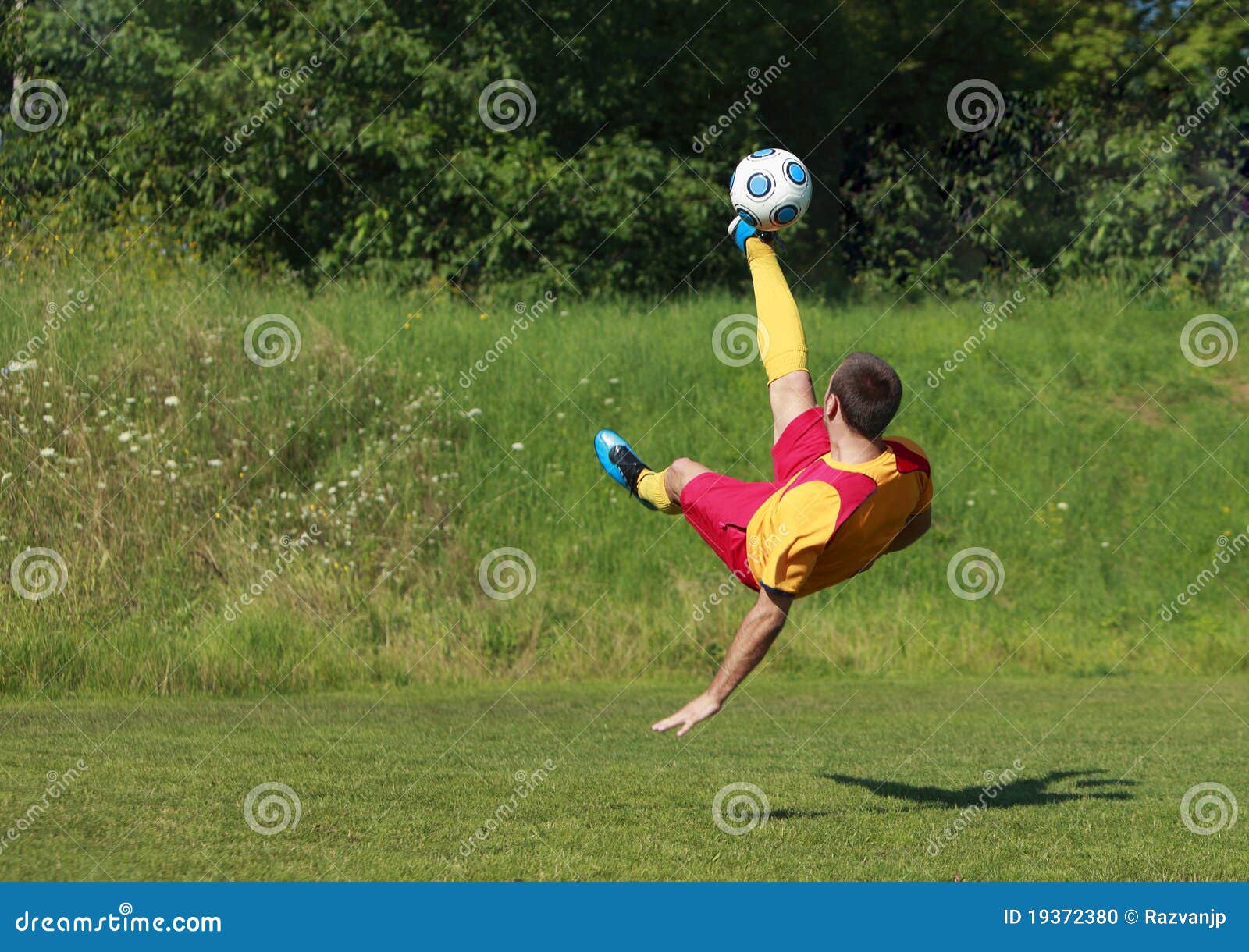 Acrobatic soccer player stock photo. Image of socks, player - 19372380