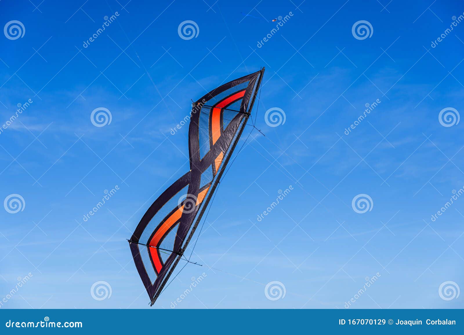 Acrobatic Stunt Kite Flying in the Blue Sky Stock Image - Image of ...