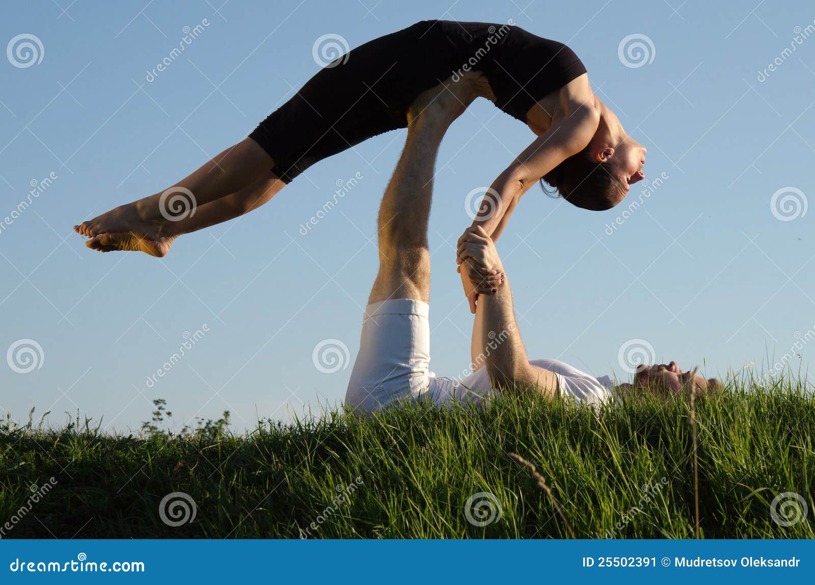 Acrobatic Yoga. stock image. Image of bending, grass - 25502391
