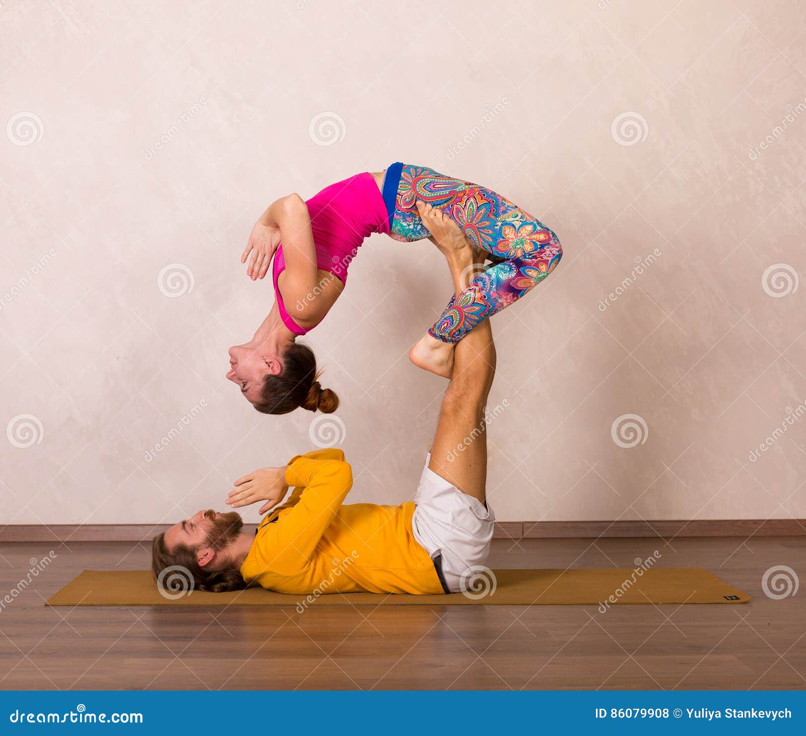 Acrobatic yoga in a studio stock photo. Image of stretching - 86079908