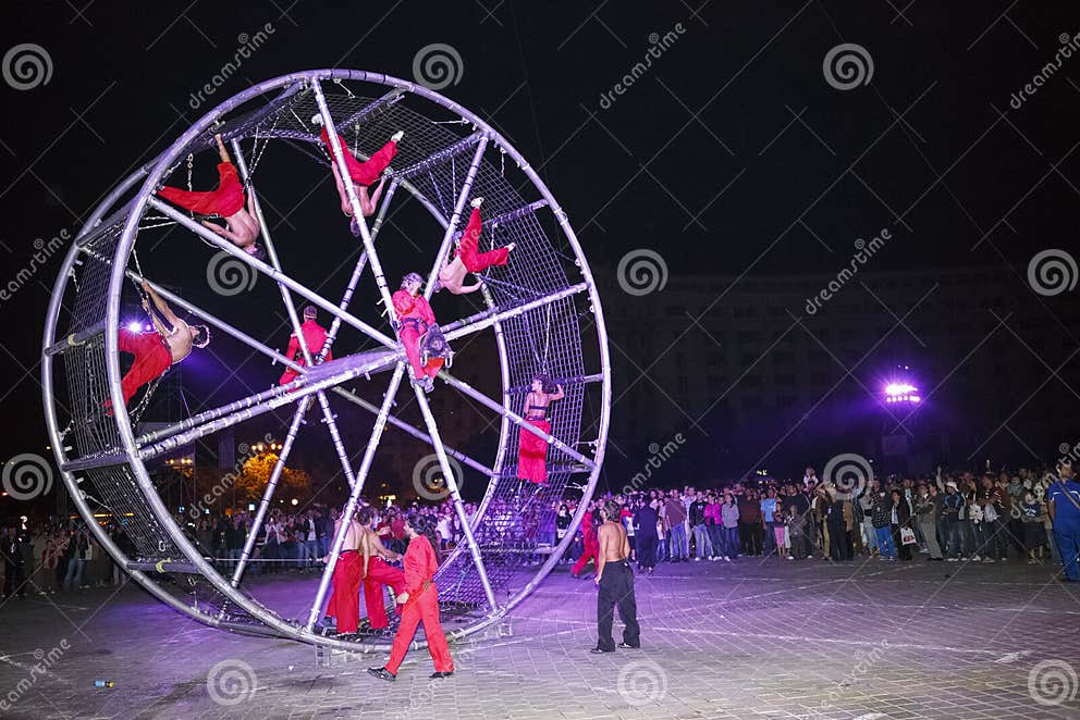 Acrobats and giant wheel editorial photography. Image of group - 26670897