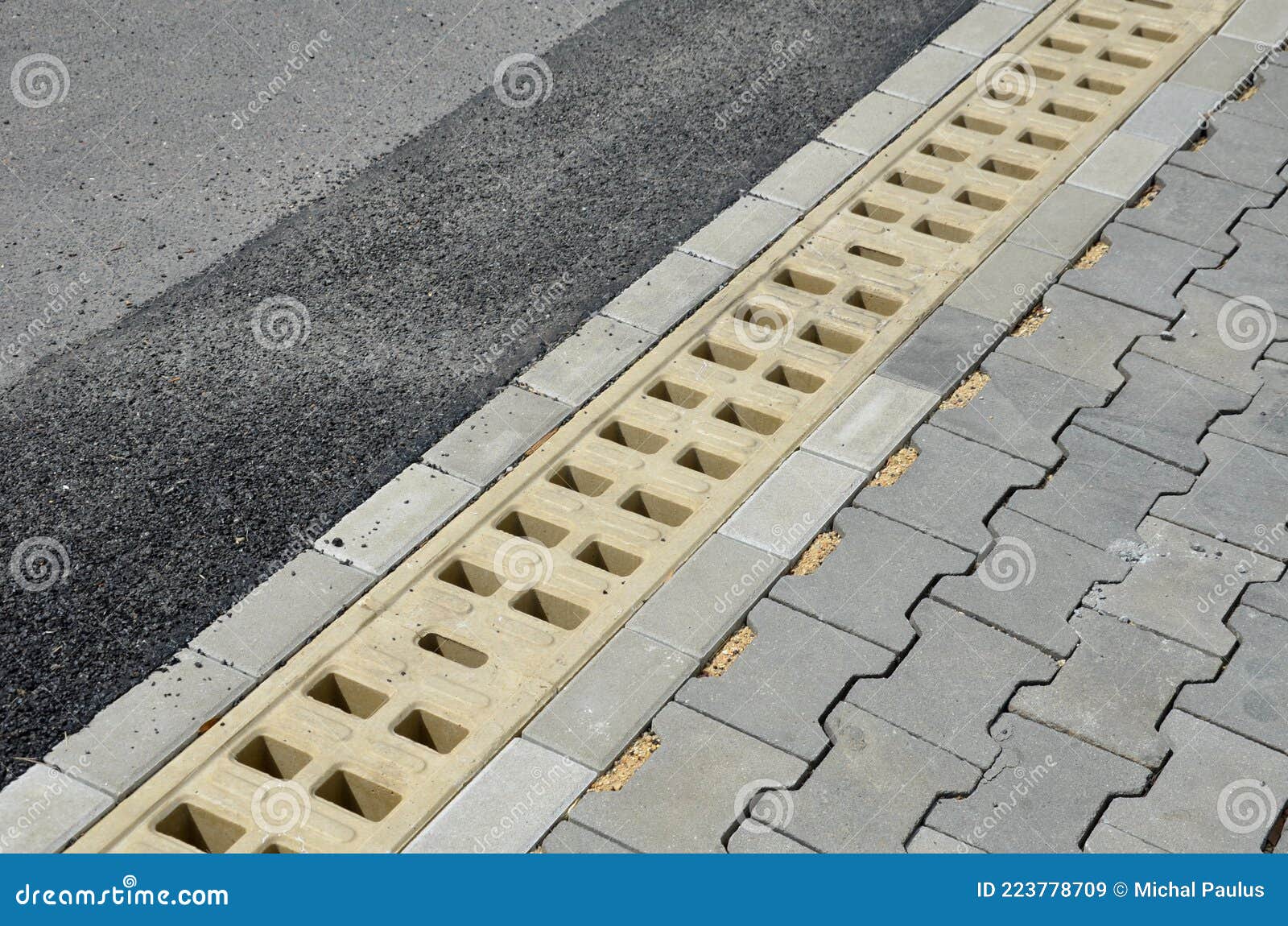 Across the Path There is a Channel with a Metal Grid for Drainage ...