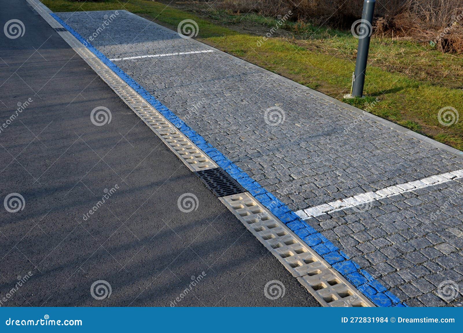 Across the Path There is a Channel with a Metal Grid for Drainage Stock ...