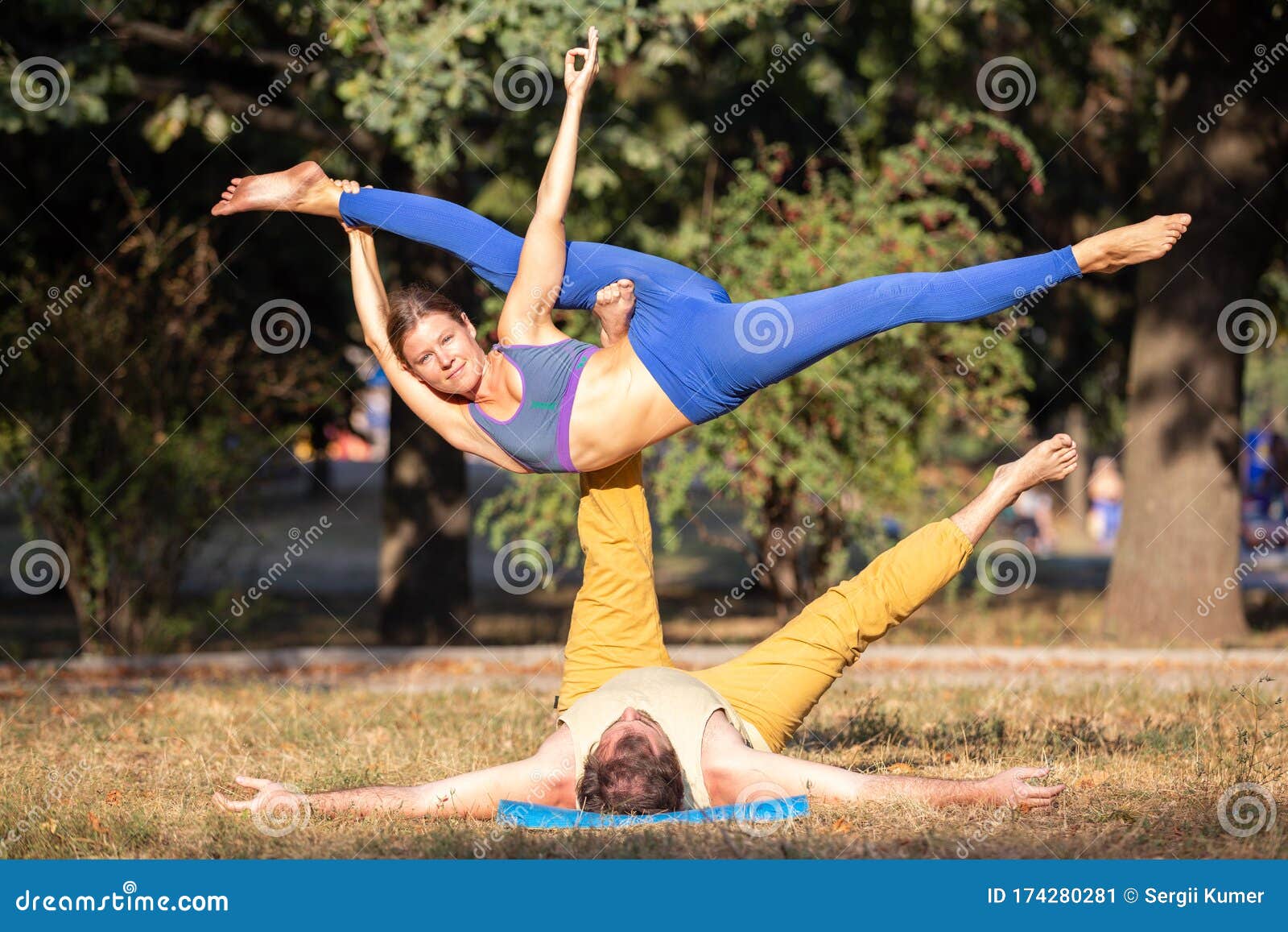 Acro Yoga Couple Practising Handle Dangle Pose Stock Image - Image of ...