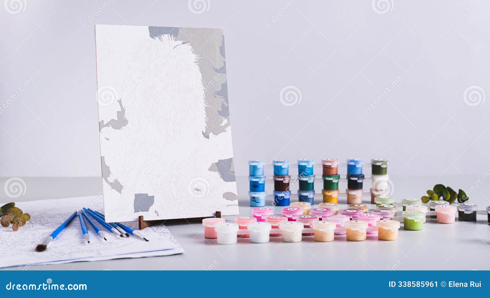 Acrylic Paints, Brushes and Canvas for Painting by Numbers on the Table ...