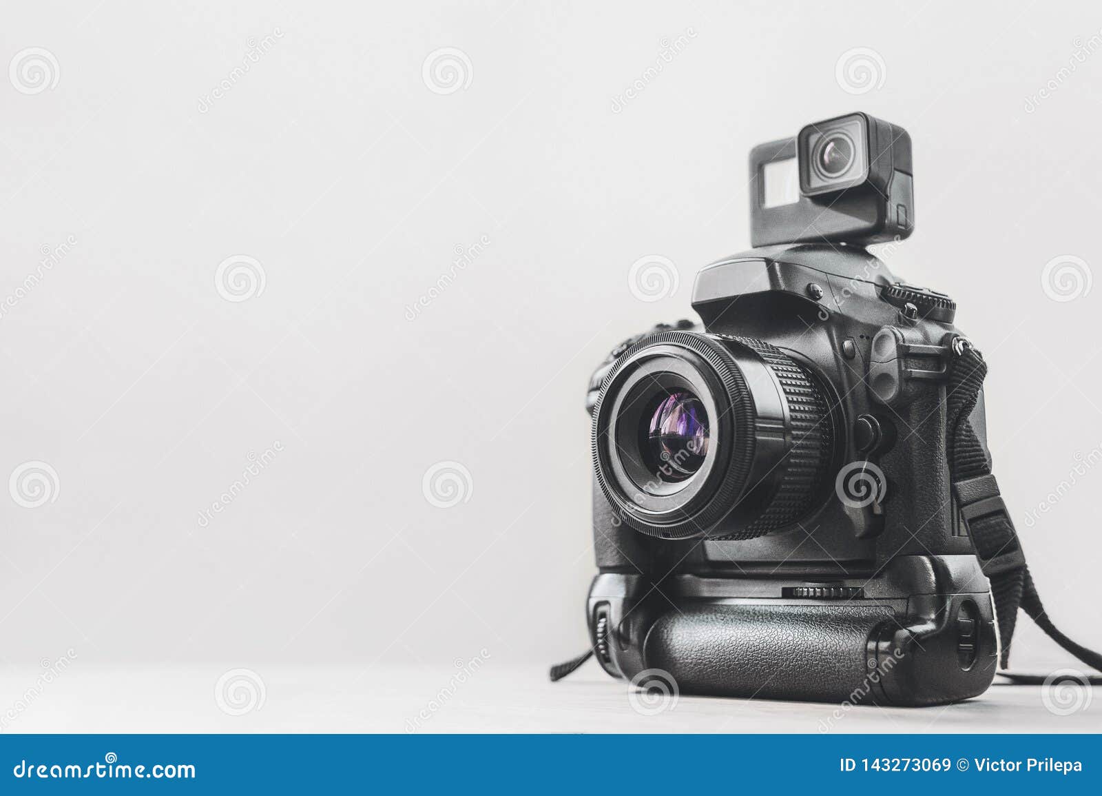Action Camera with a Professional Camera on a White Background. Stock ...