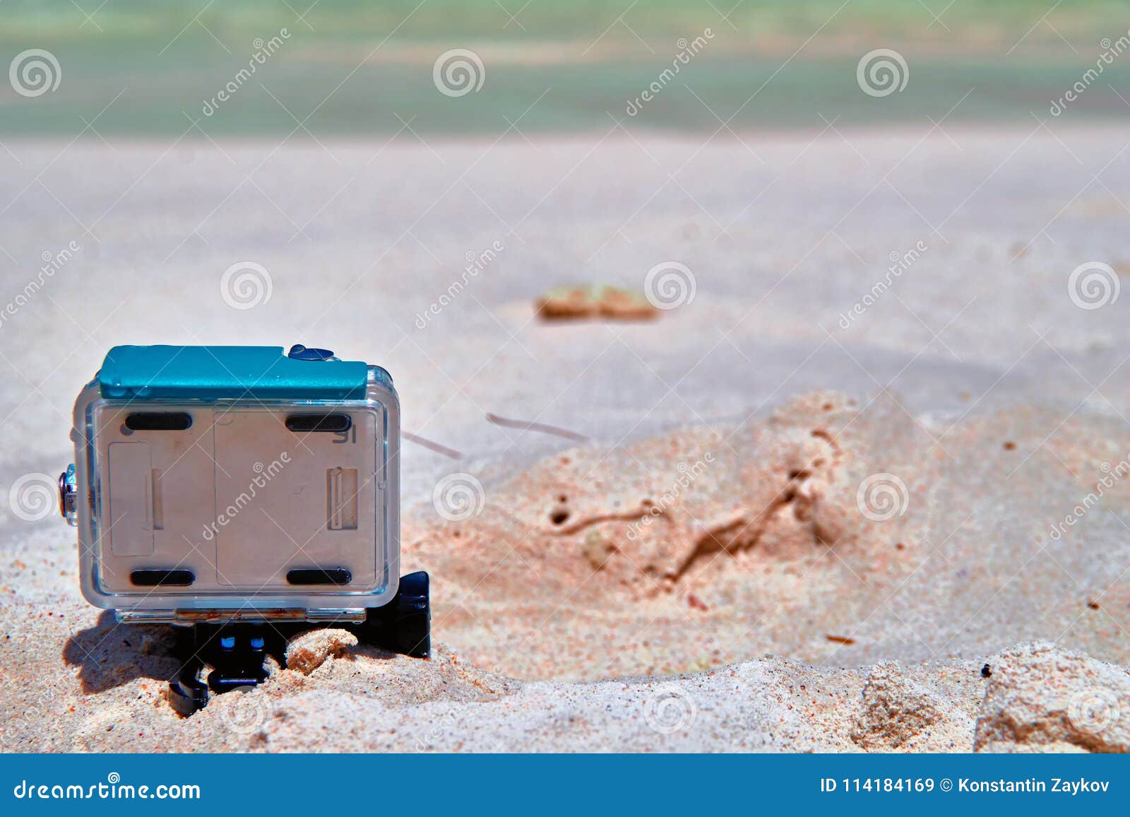 Action Camera in a Protective Box Stands on the Sand on Tropical Beach ...