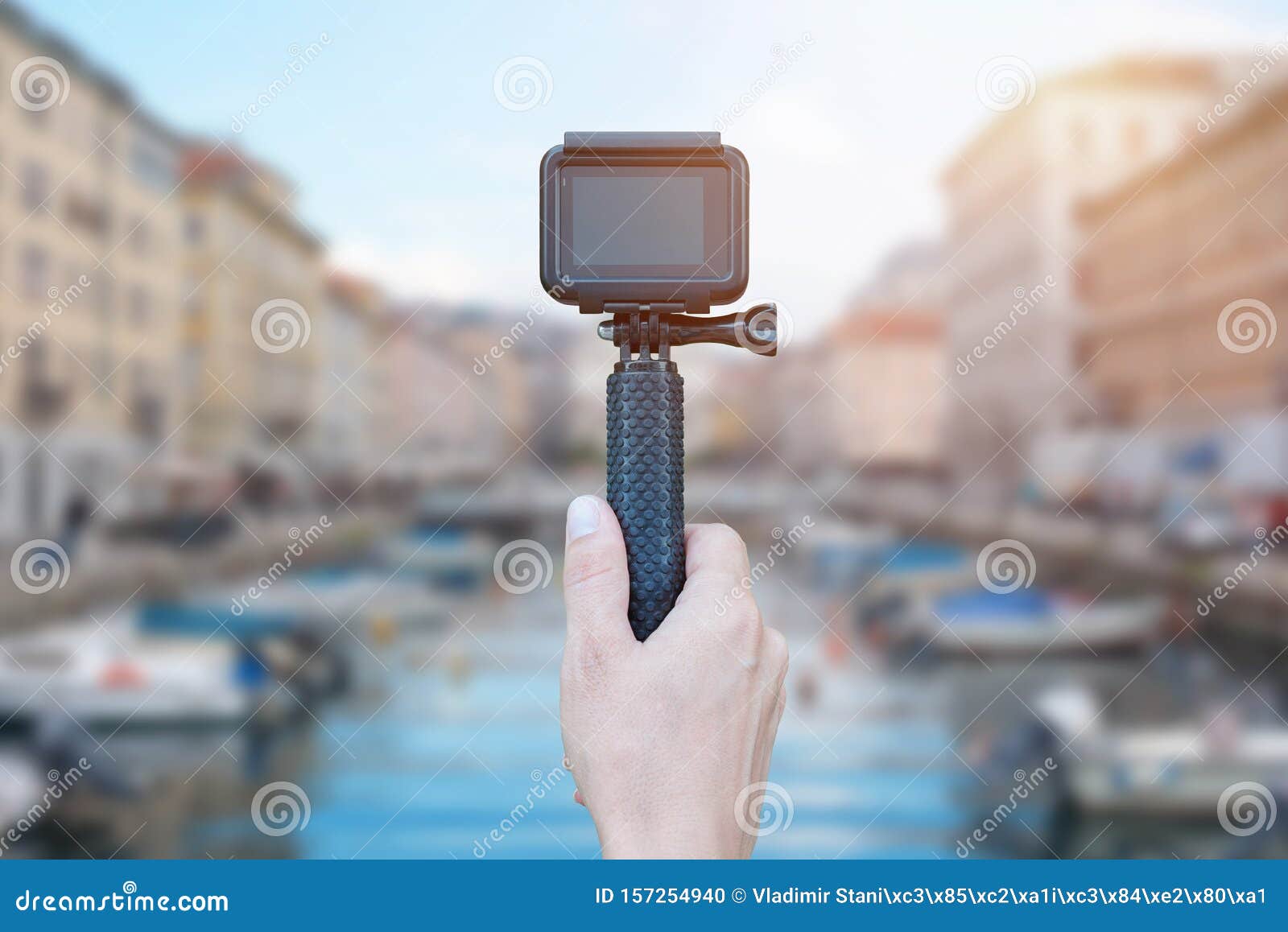 Action Camera on Stick in Hand Recording City Concept Stock Photo ...