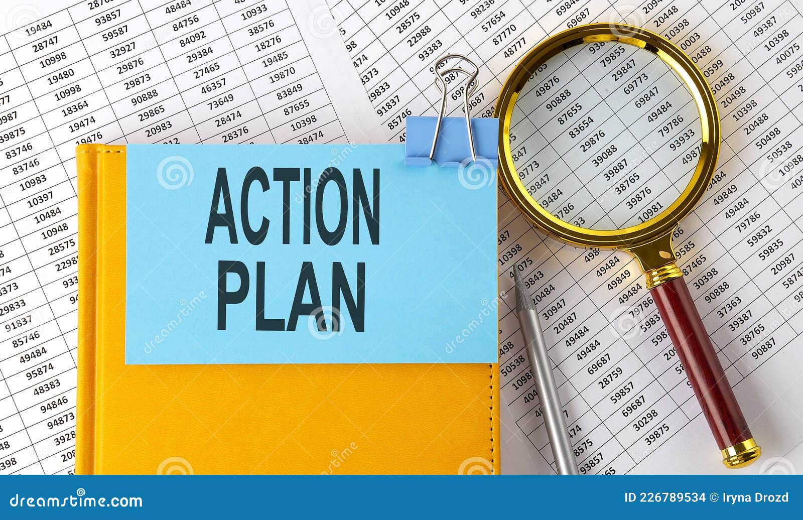 ACTION PLAN Text on Sticker on Notebook with Magnifier and Chart ...