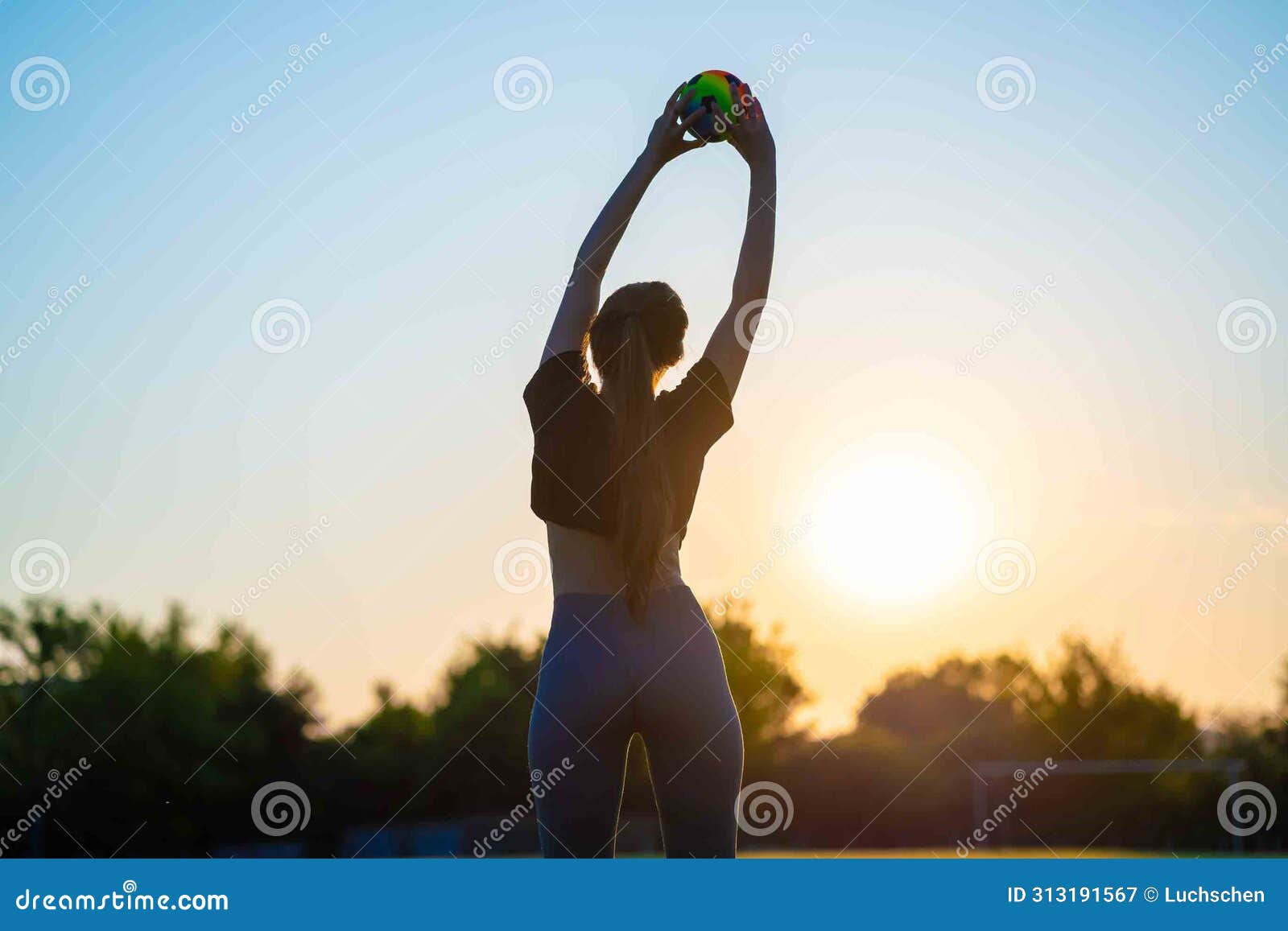 An Active Athlete Exercising Under a Backlit Sunset Sky Stock Image ...