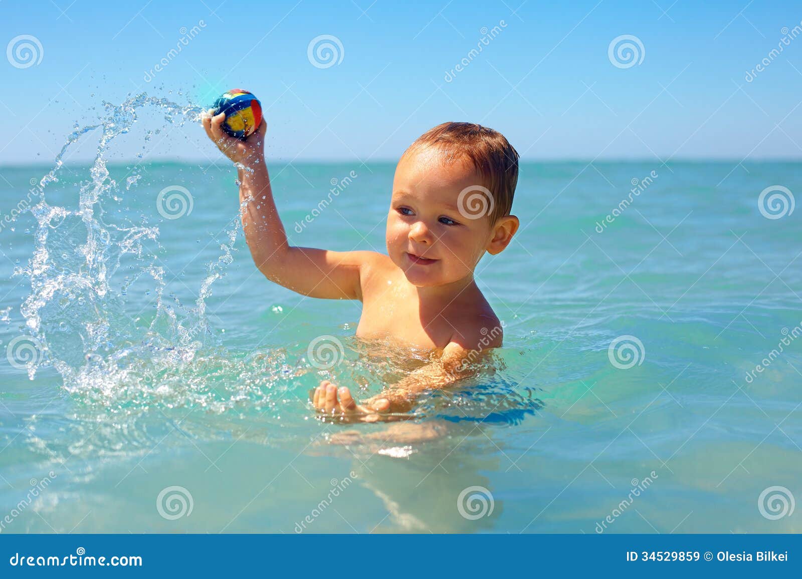 Active Baby Playing Water Game in the Sea Stock Image - Image of ...