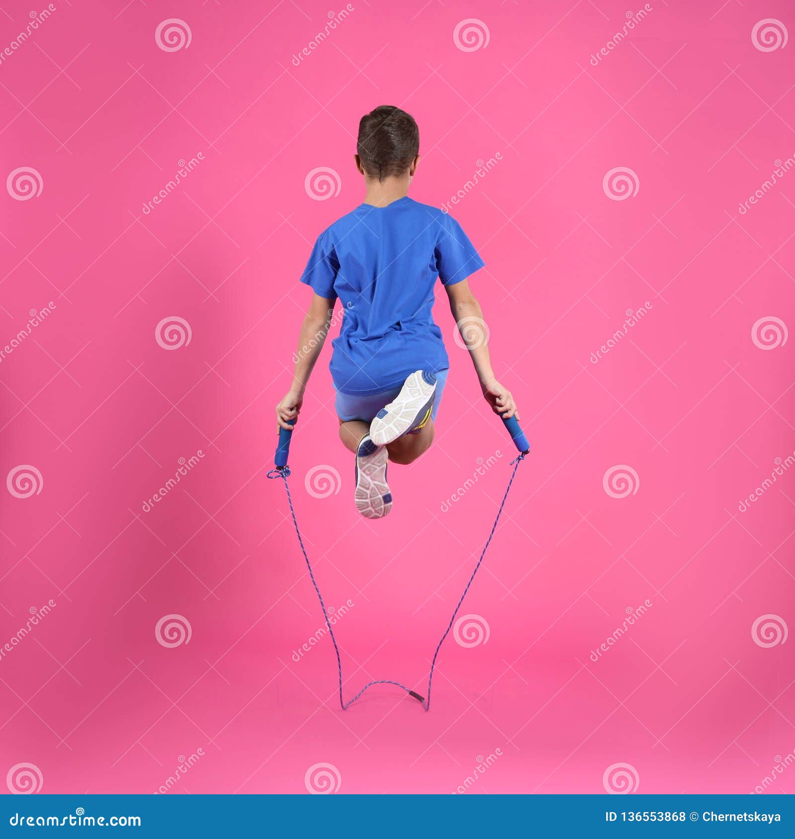 Active boy jumping rope stock photo. Image of action - 136553868