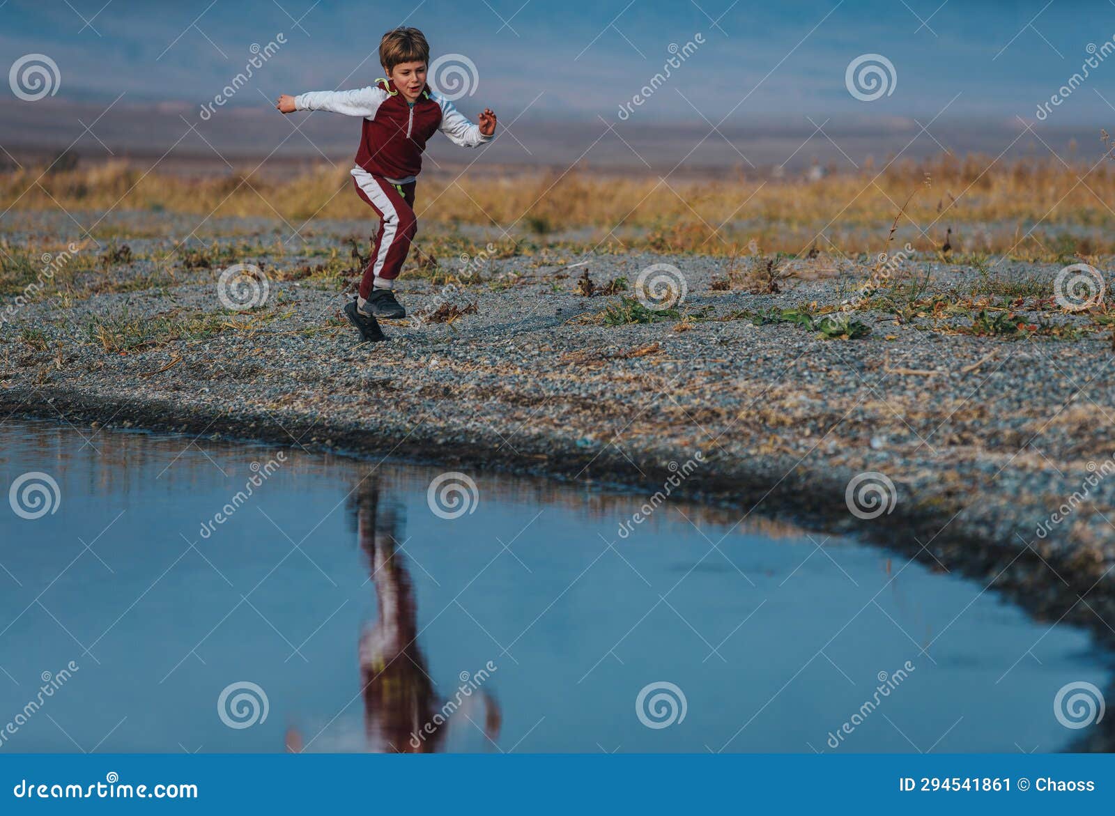 Active Boy Running on the Lake Shore Stock Image - Image of river ...