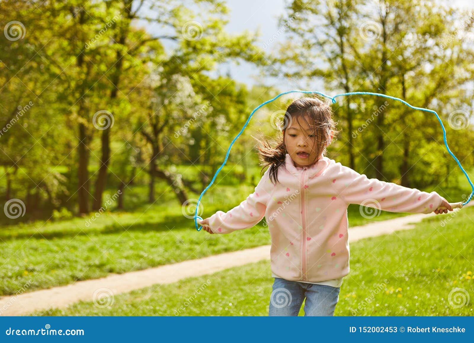 Active Child Jumps with the Skipping Rope in the Park Stock Image ...