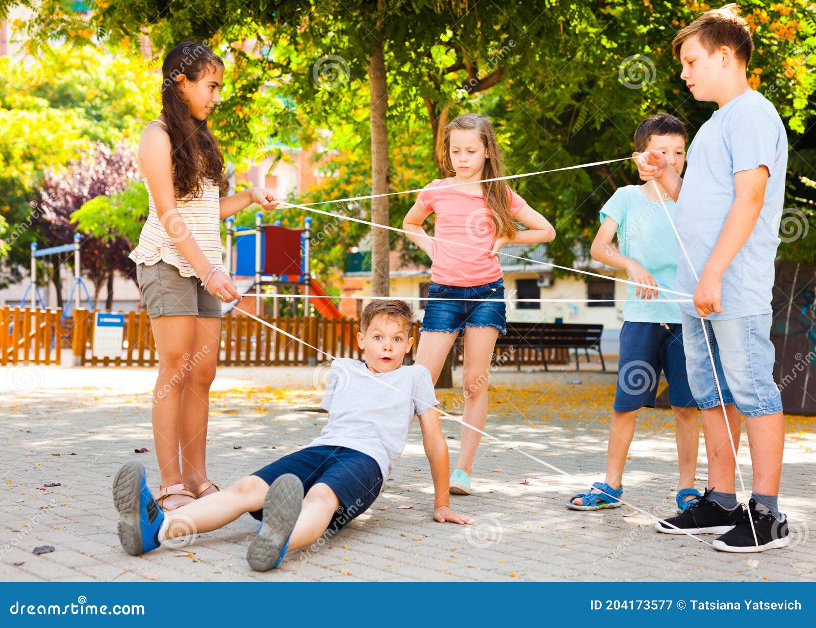 Active Children Games. Boy Gently Passes through the Tangled Rope Stock ...