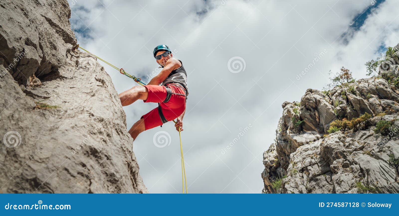 Active Climber Middle Age Man in Protective Helmet Looking at Camera ...
