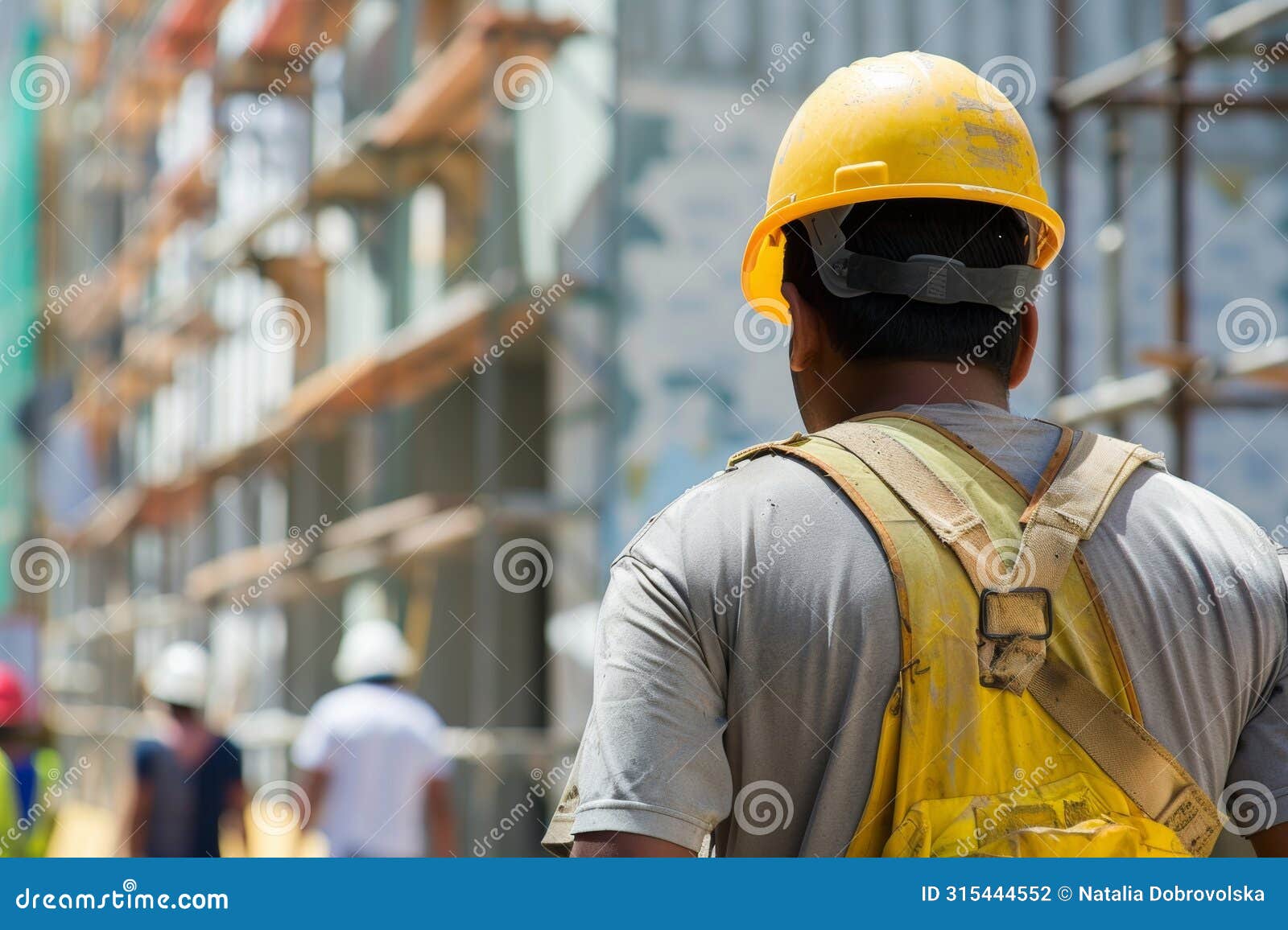 Active Construction Site with Workers, Machines, and Scaffolding ...