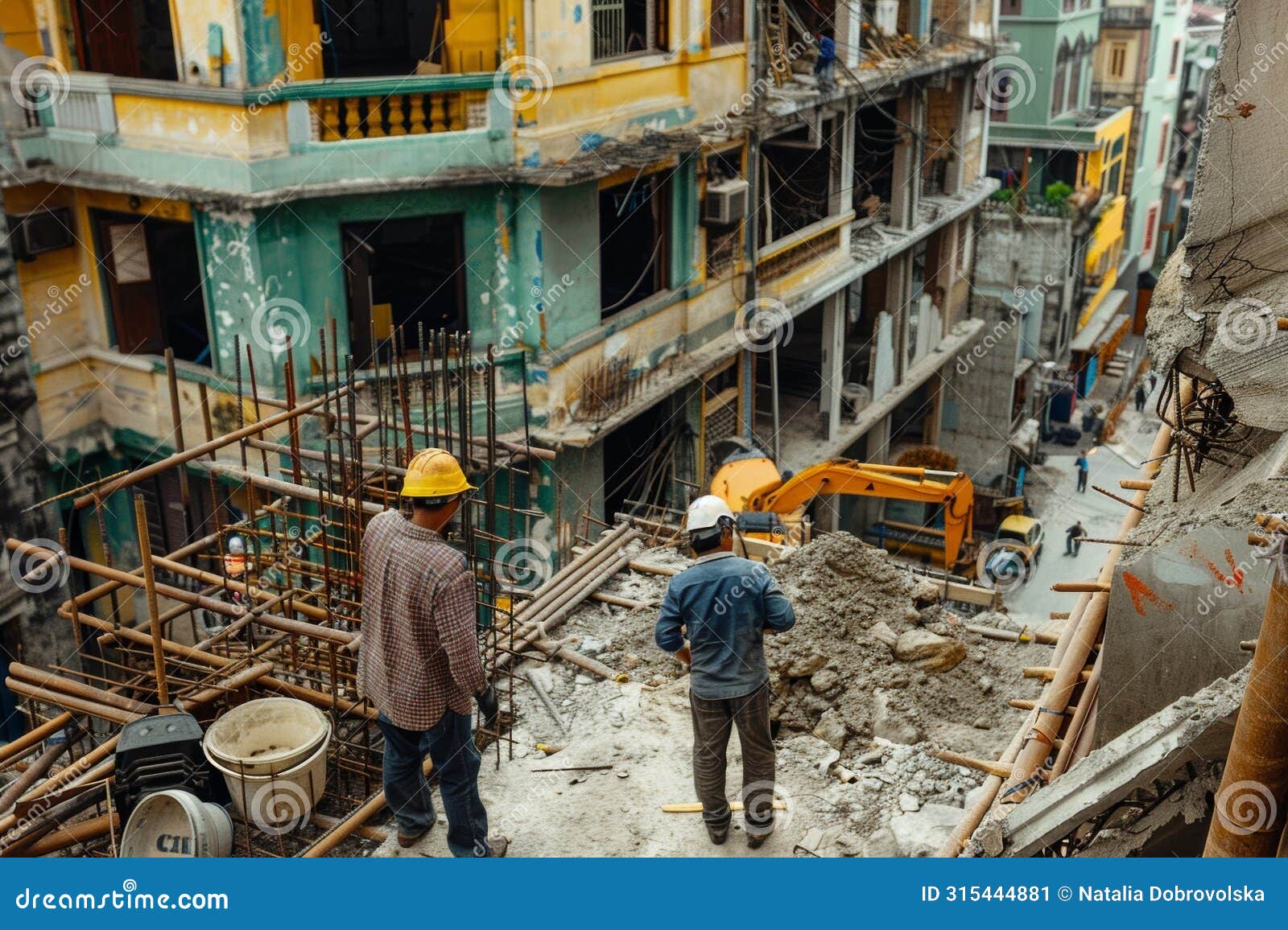 Active Construction Site with Workers, Machines, and Scaffolding ...