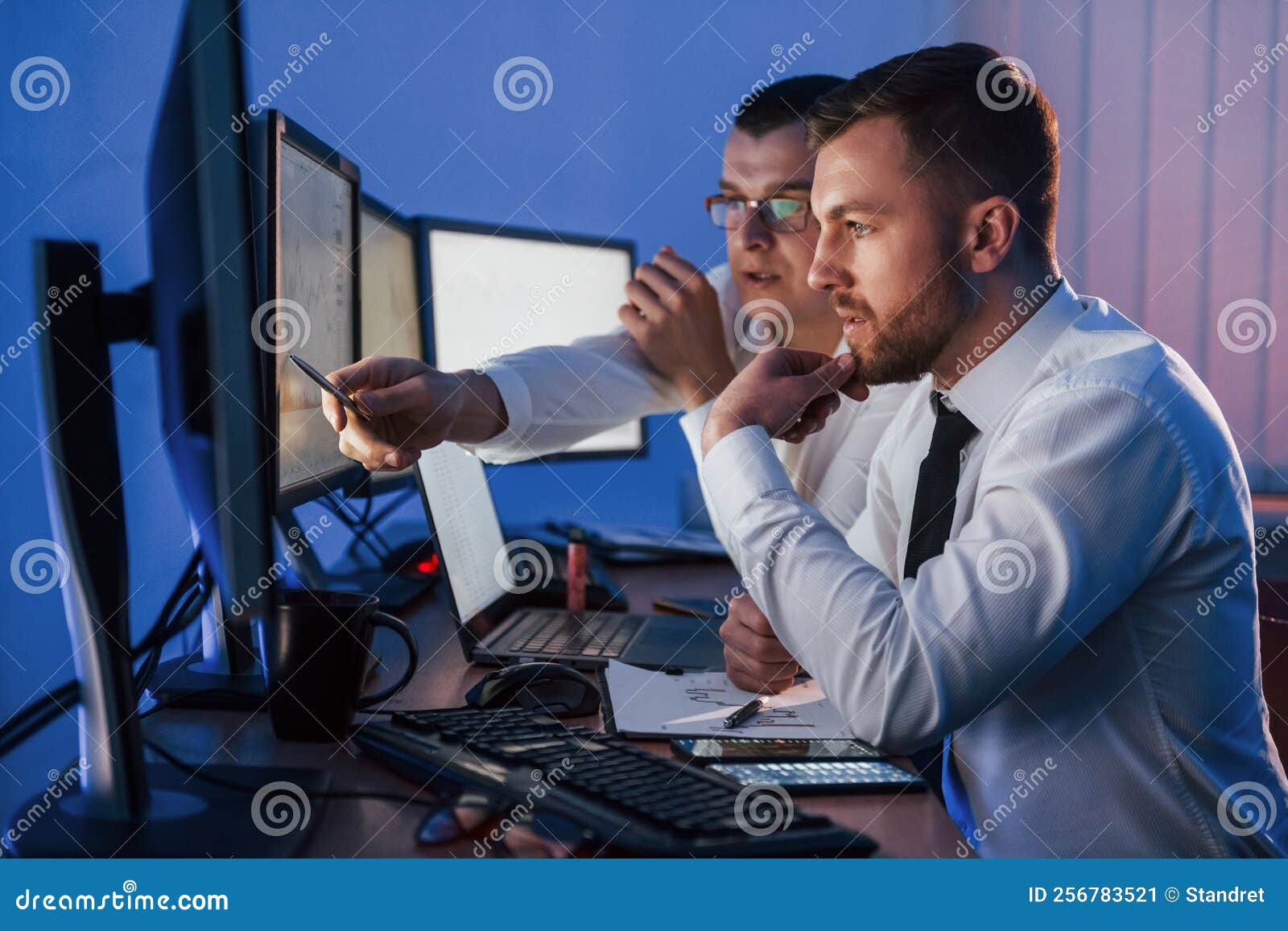 Active Conversation. Two Stock Traders Working in the Office with ...