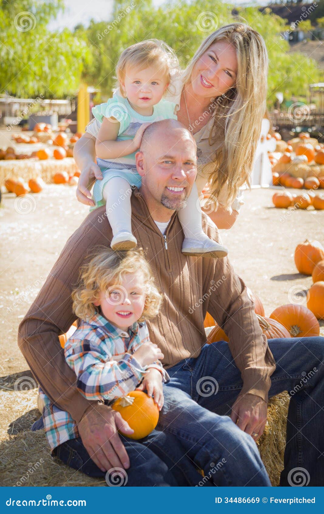 Active Family Portrait at the Pumpkin Patch Stock Image - Image of ...