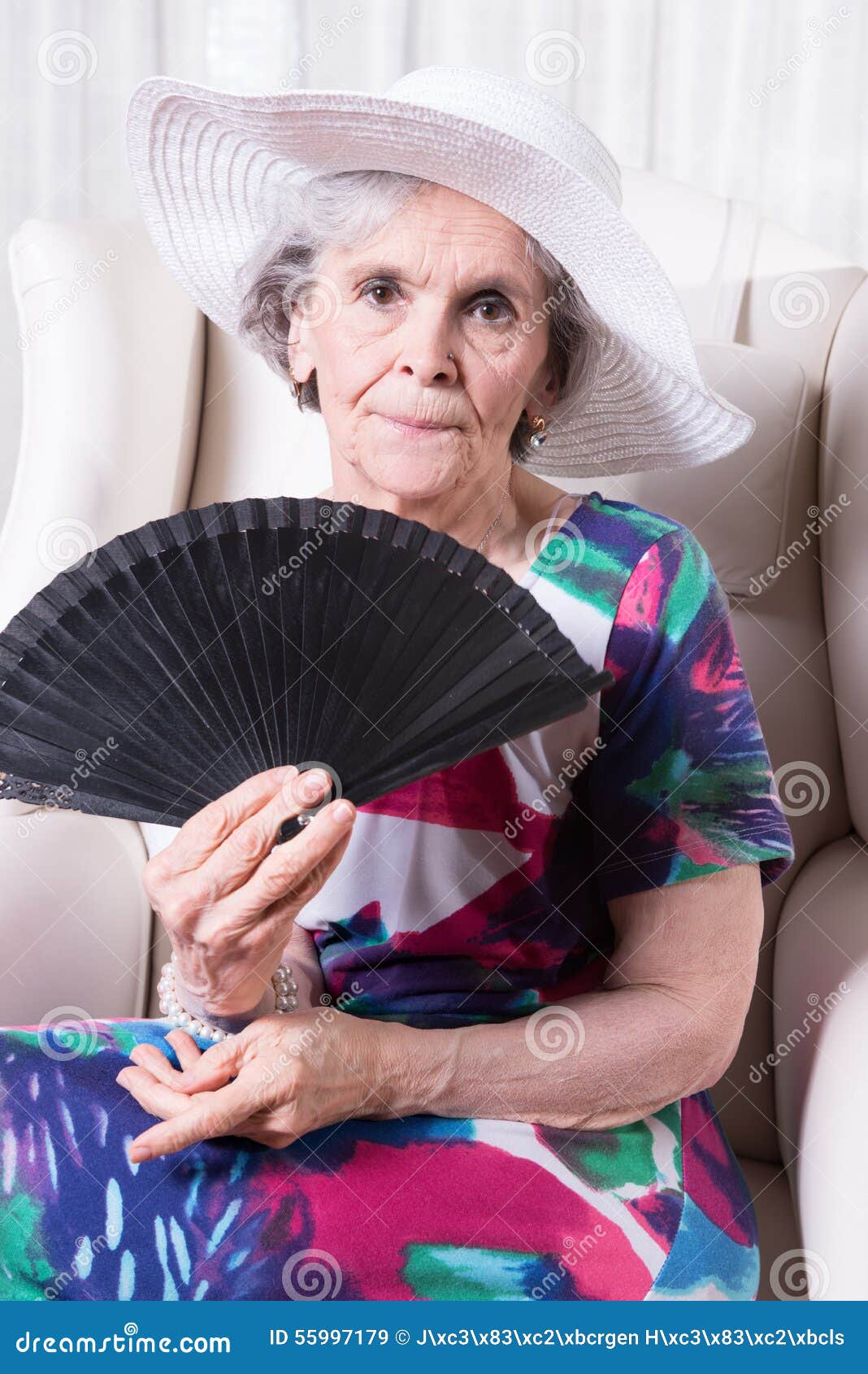 Active Female Senior with Fan in Her Hand Stock Image - Image of ...