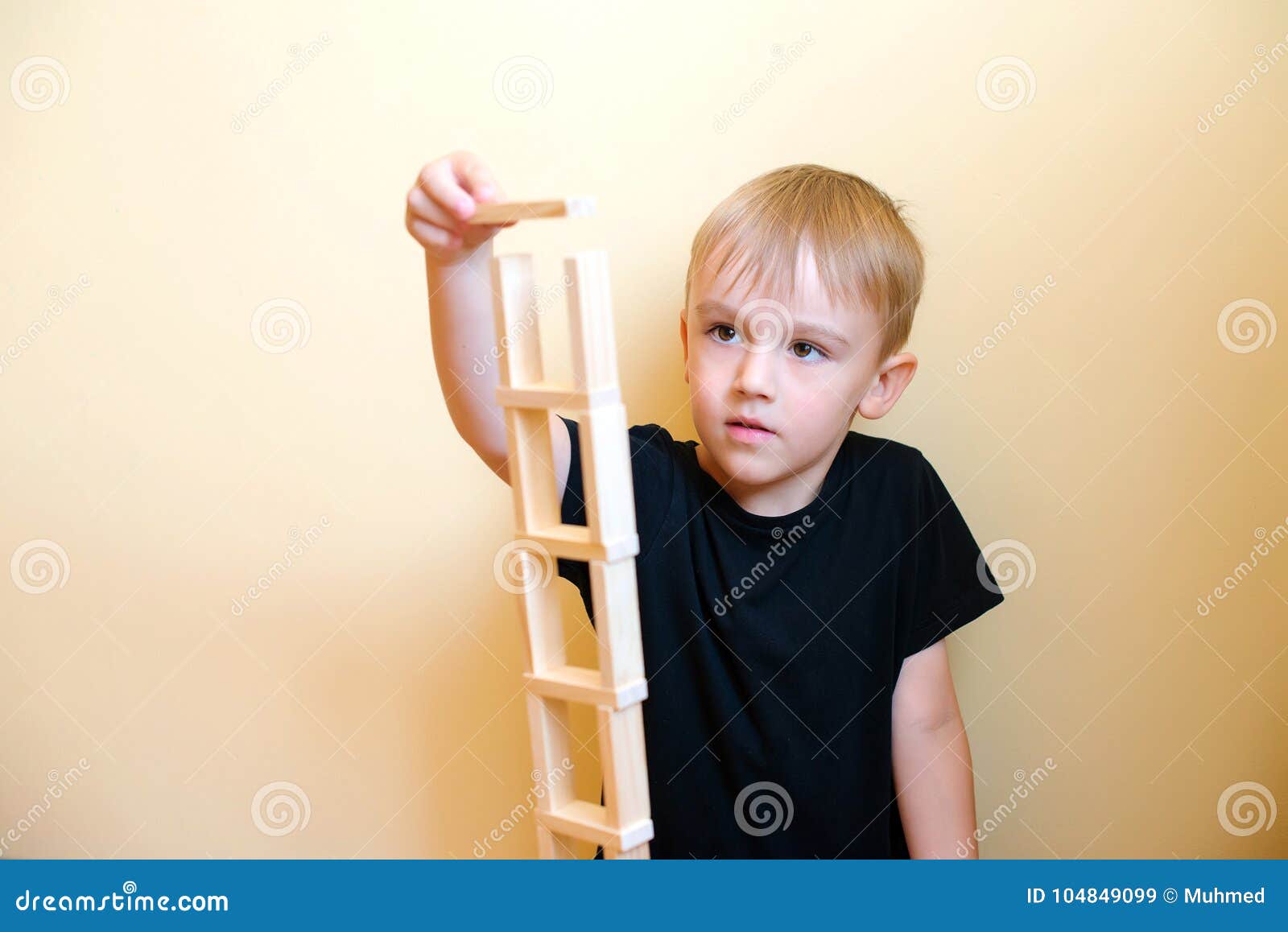 Active Funny Kid Boy Is Building A Structure From Nature Wooden ...