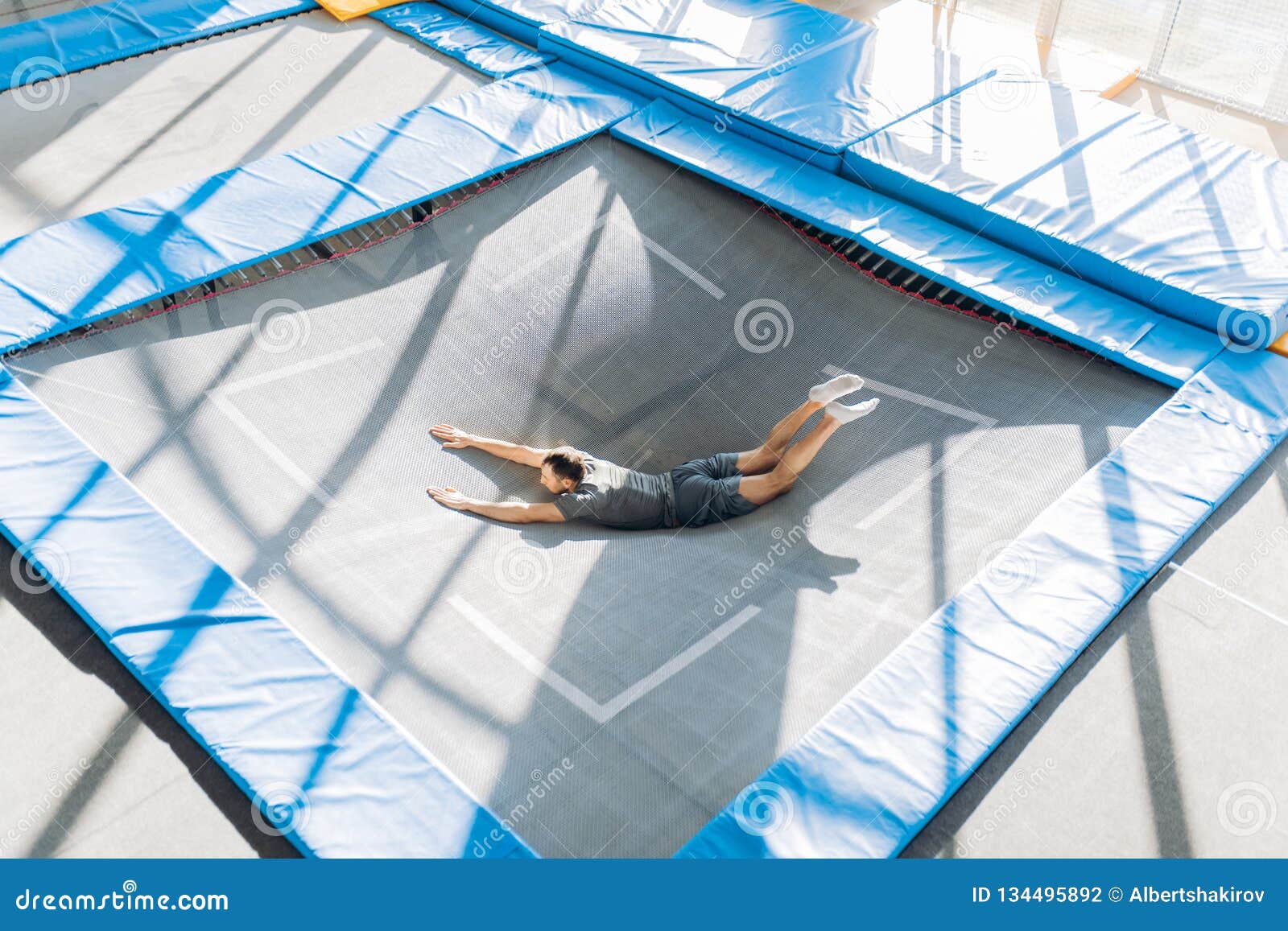 Active Funny Man Bouncing on Trampoline Along Stock Photo - Image of ...