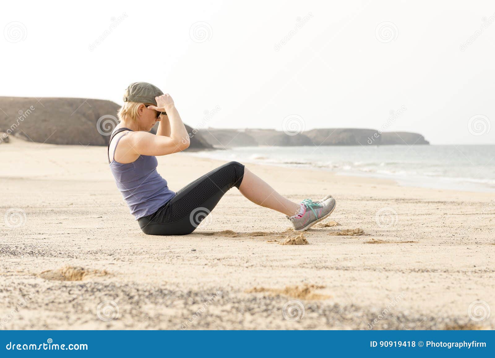 Active Lady Doing Sit-Ups by the Seaside Stock Photo - Image of healthy ...