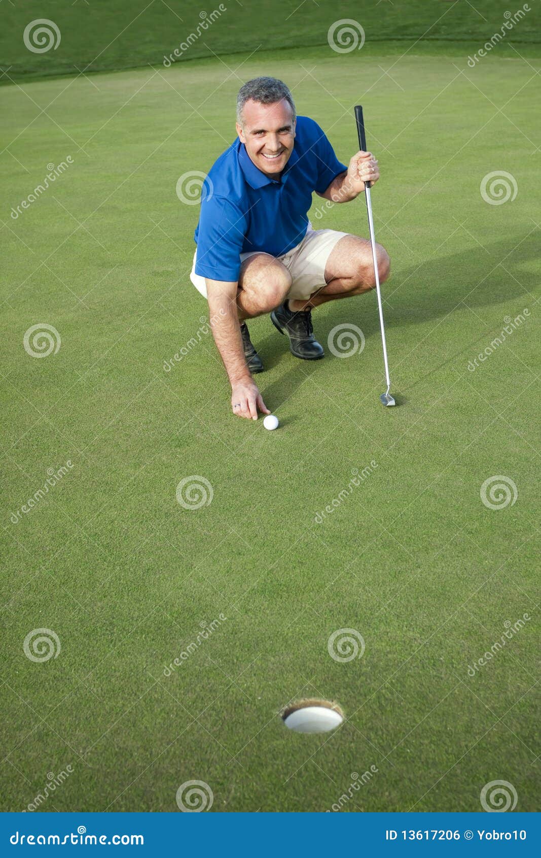 Active Male Golfer Putting stock photo. Image of handsome - 13617206