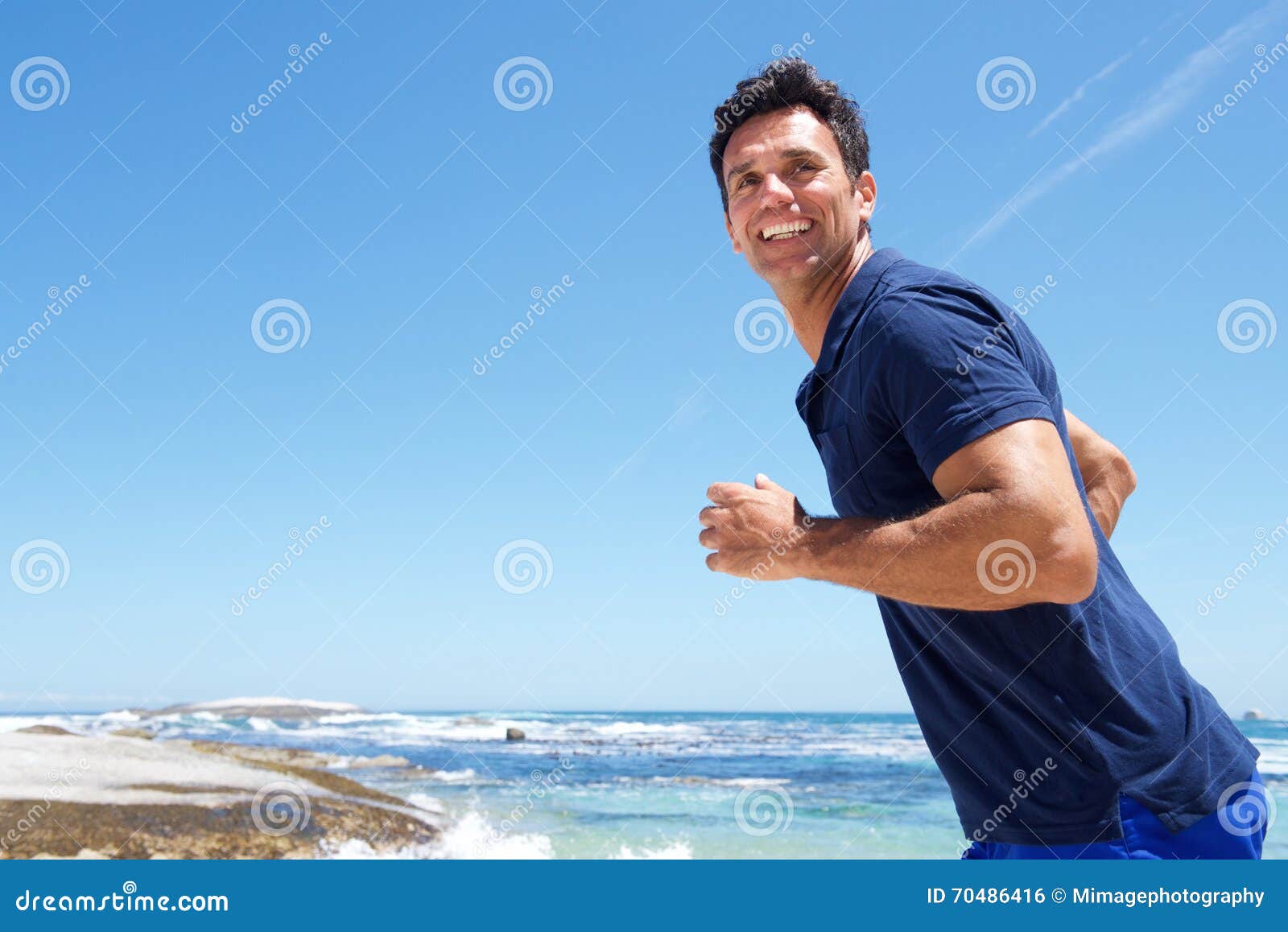 Active Man Casually Running at the Beach Stock Photo - Image of ...