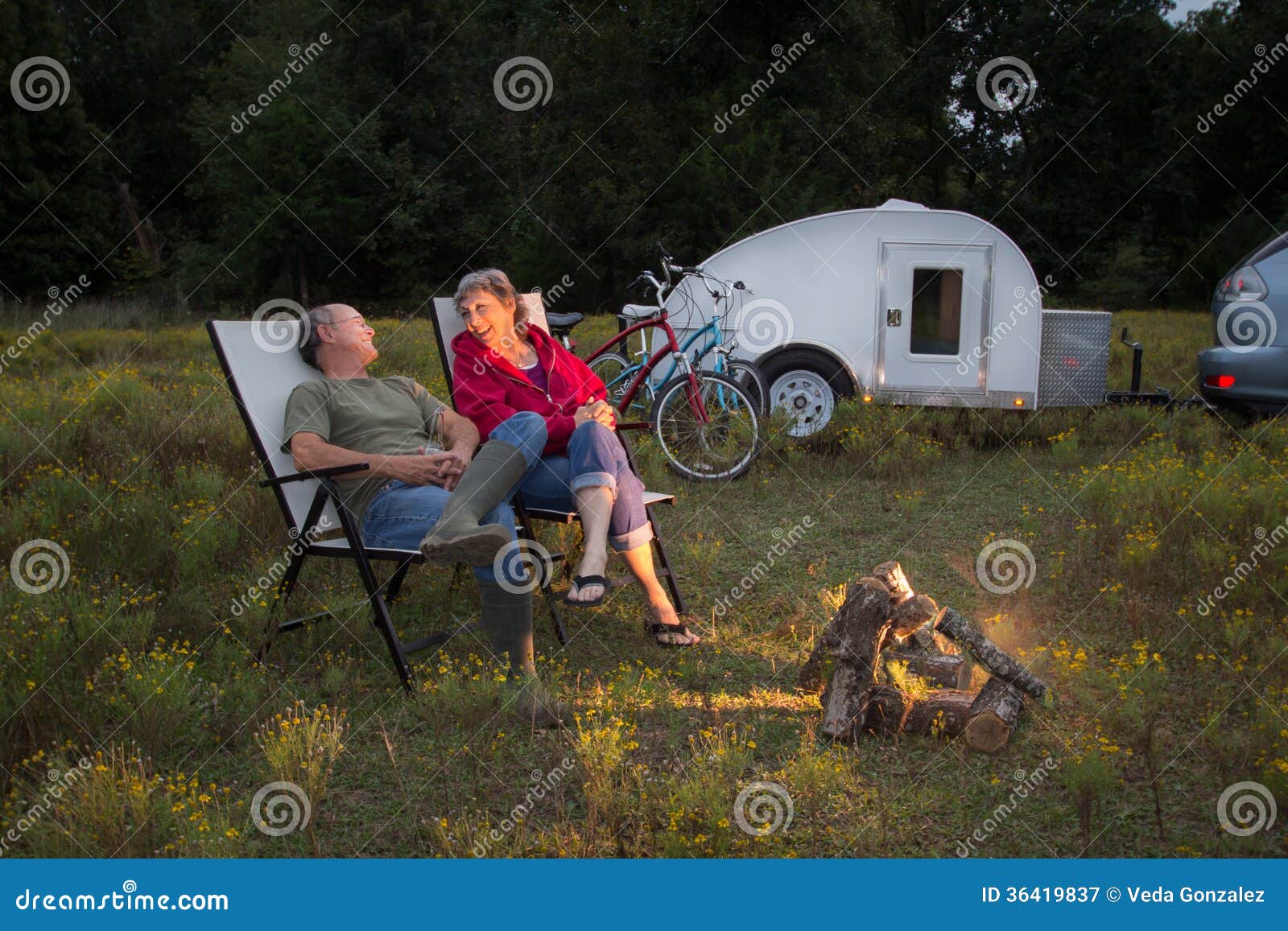 Couples In RV Camper Looking At The Local Map For The Trip Stock Photo ...