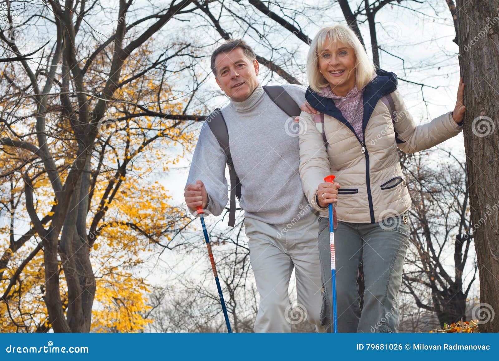 Active Middle Aged Couple Hiking Outdoors Stock Photo - Image of ...