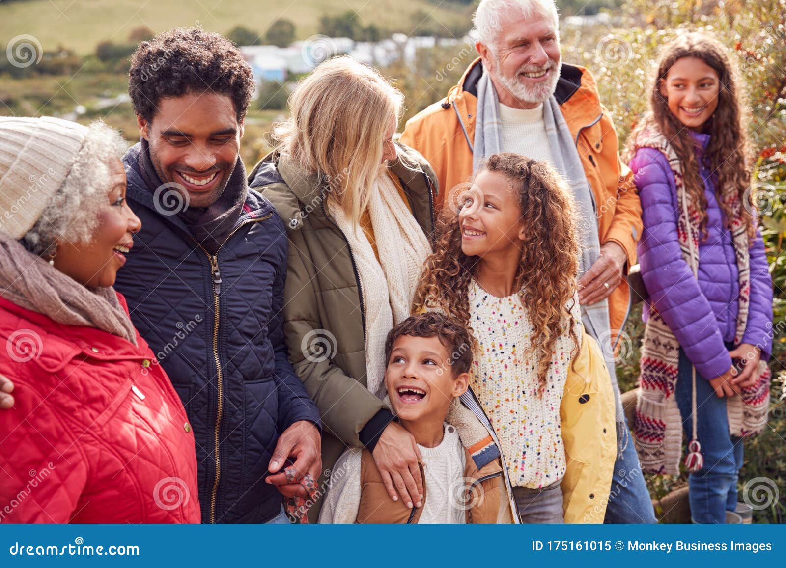 Active Multi-Generation Family on Winter Beach Vacation Resting by Gate ...