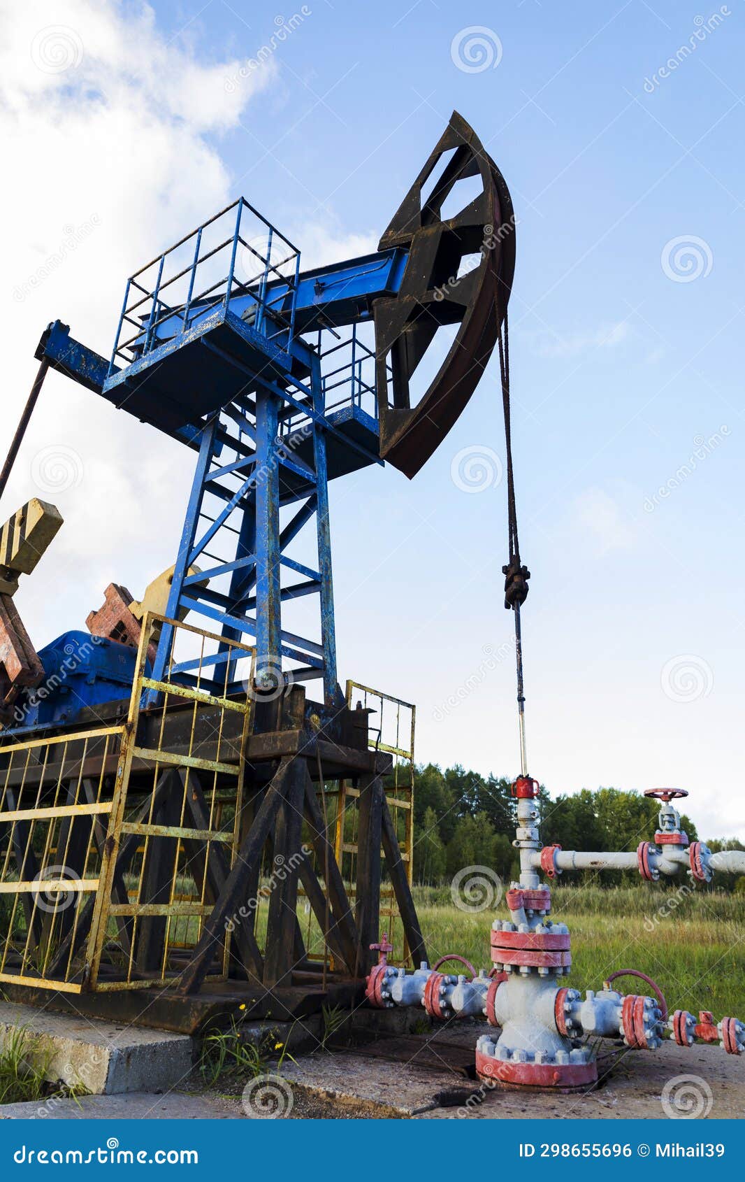 An Active Oil Rig Operating at Sunrise or Sunset. Resource Extraction ...