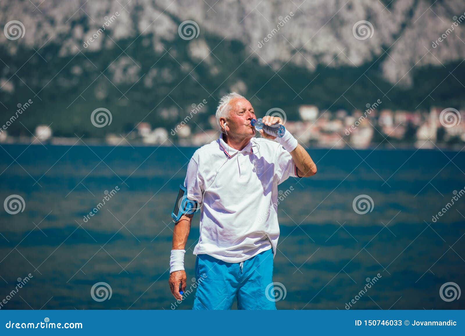 Senior Drinking Water from Bottle at the Beach Stock Image - Image of ...