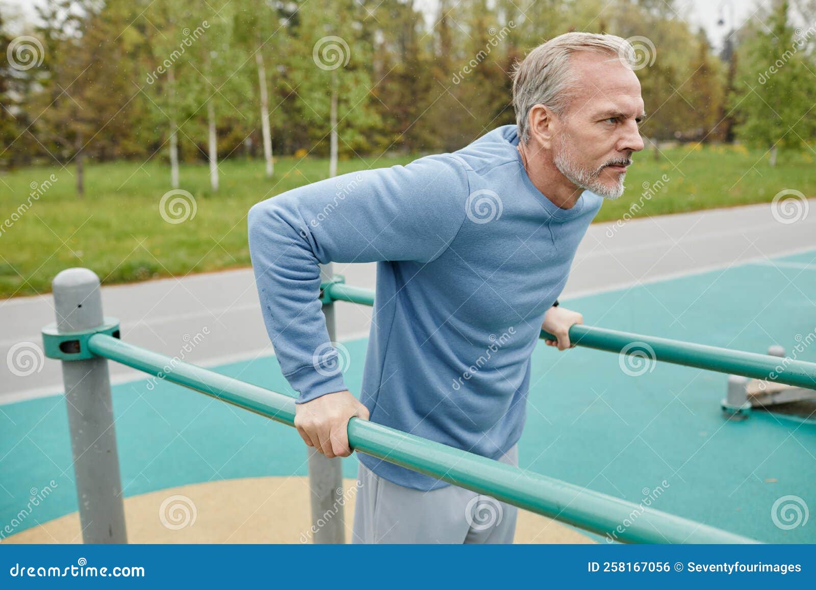 Active Senior Man on Parallel Bars Outdoors Stock Photo - Image of ...
