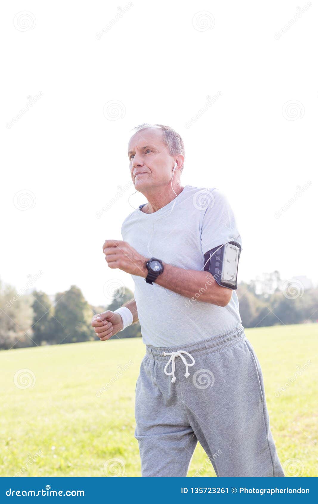 Active Senior Man Running in Park Stock Image - Image of person, senior ...