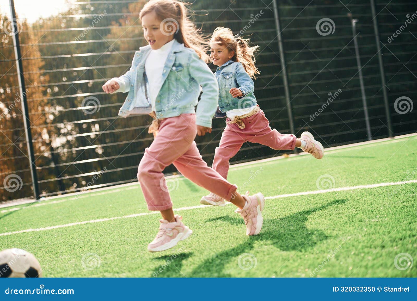 Active Weekend. Kids are Having Fun on the Green Soccer Field Together ...