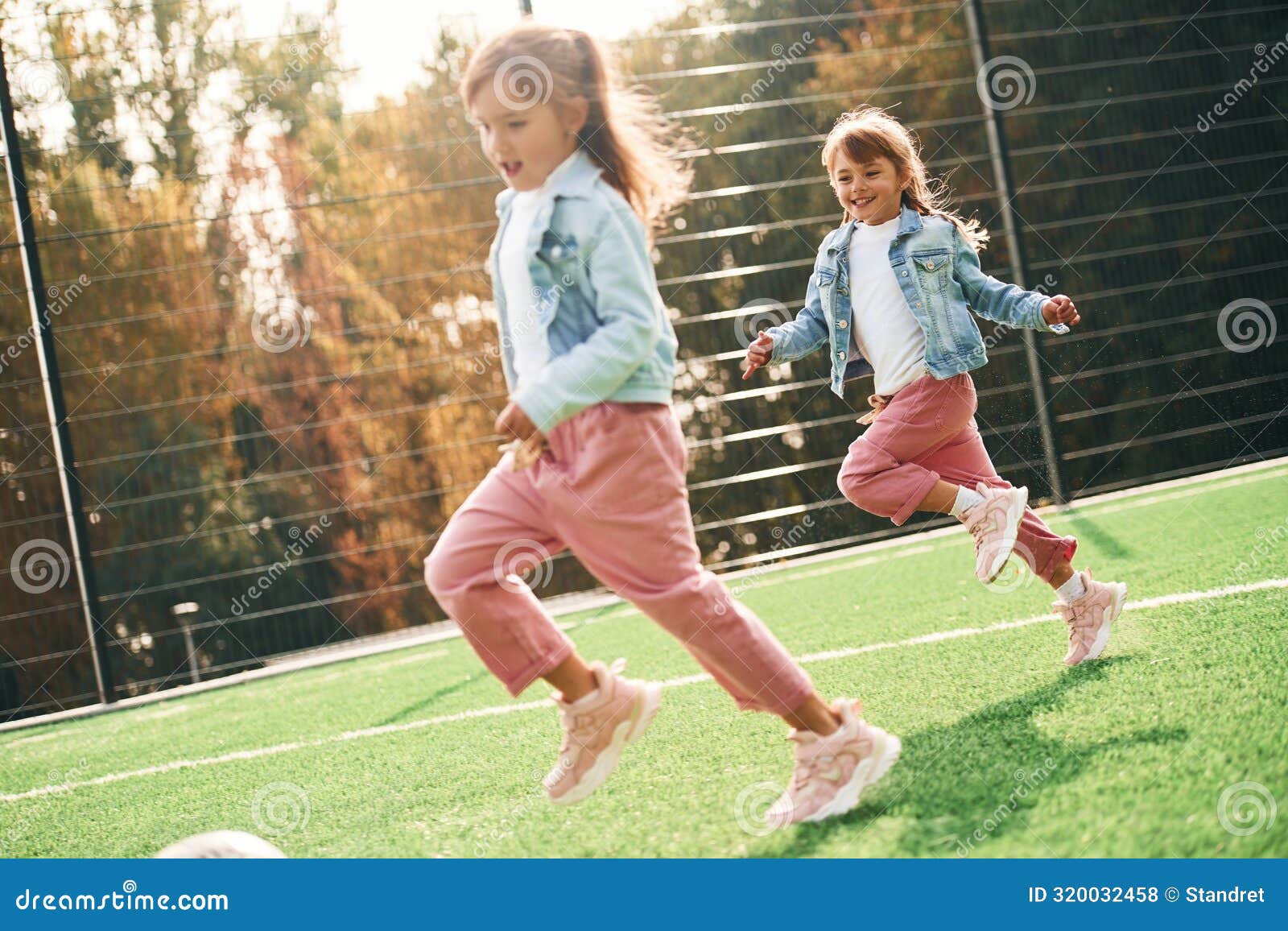 Active Weekend. Kids are Having Fun on the Green Soccer Field Together ...