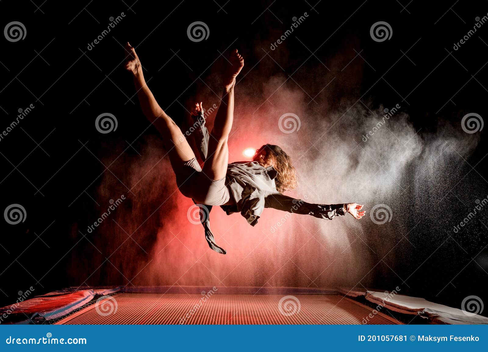 Active Woman Bouncing on Trampoline and Performs Trick in the Air at ...