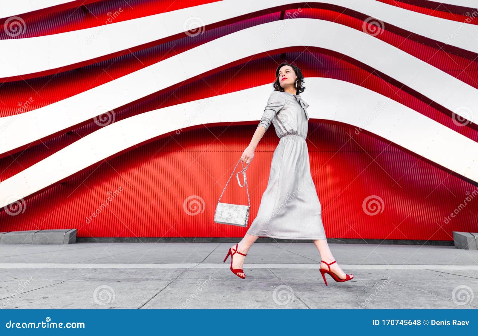 Active Woman in Heels at the Red Wall Stock Photo - Image of famous ...