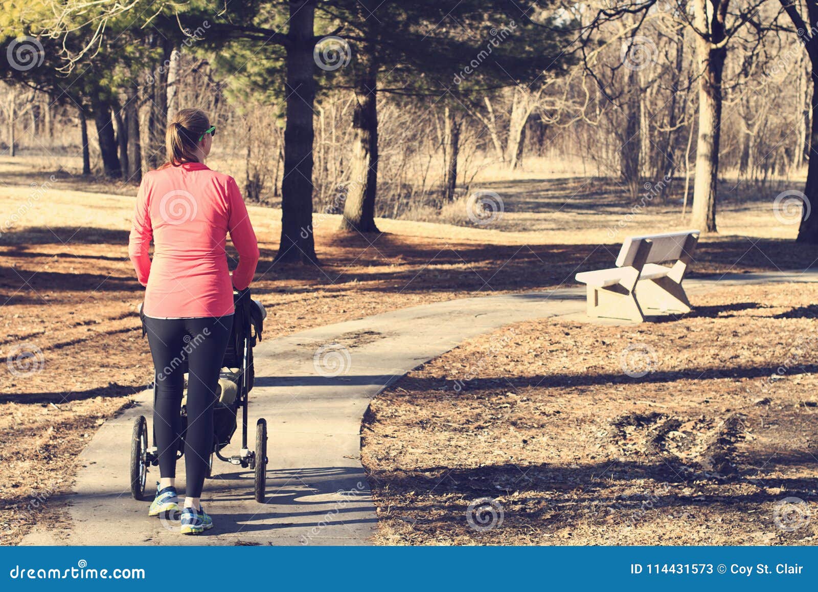 Active Woman Pushing a Stroller through a Park Stock Image - Image of ...