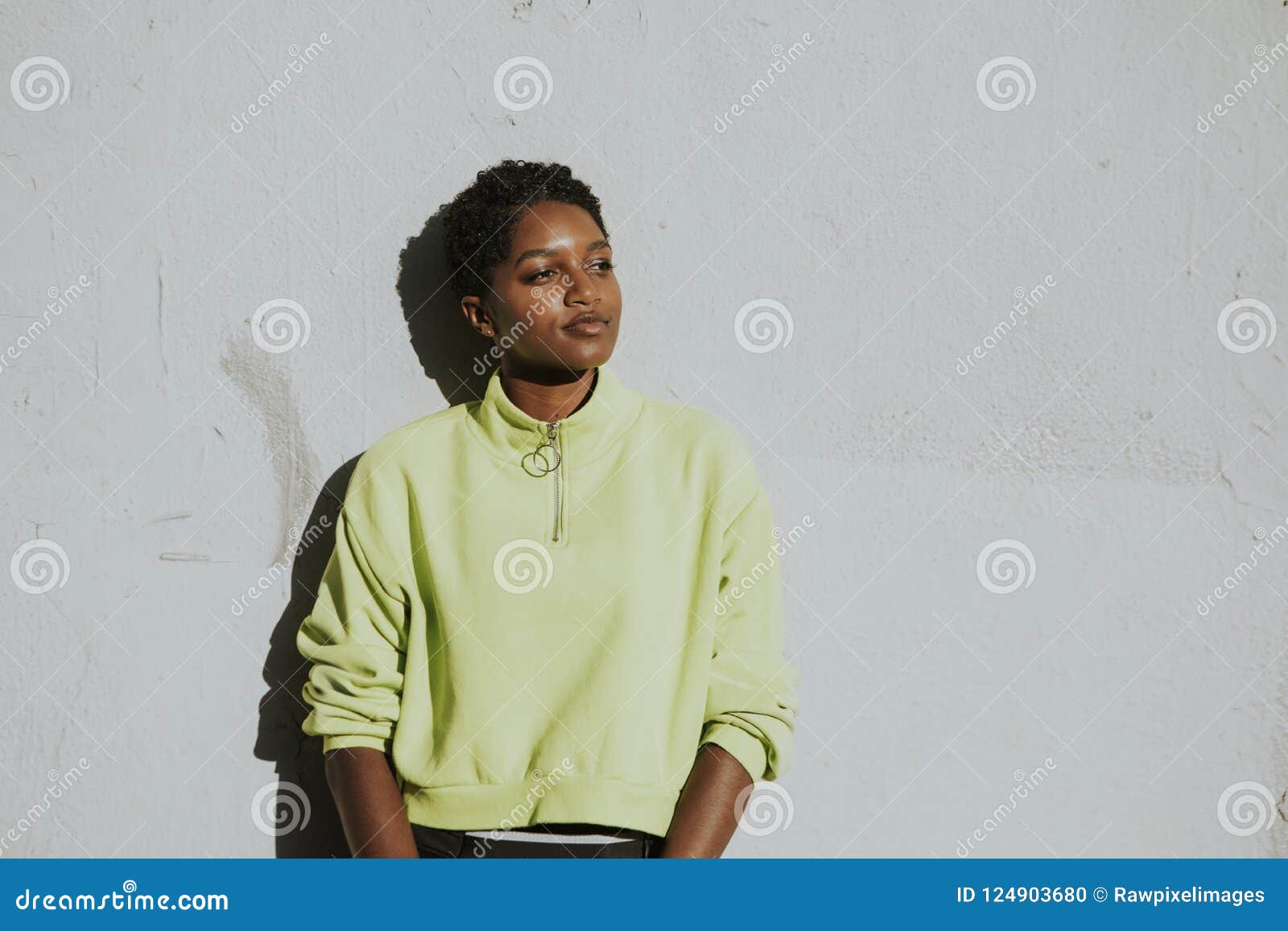 Active Woman Standing by a White Wall Stock Photo - Image of black ...