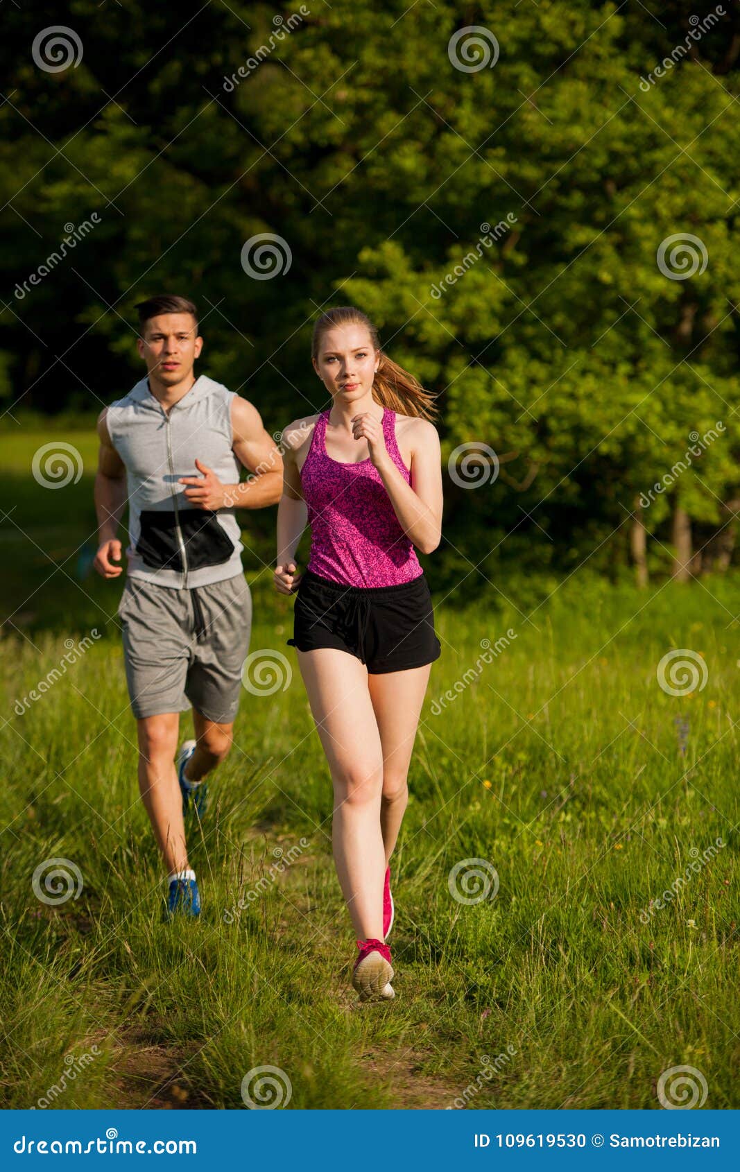 Active Young Couple Running in the Park Stock Photo - Image of people ...